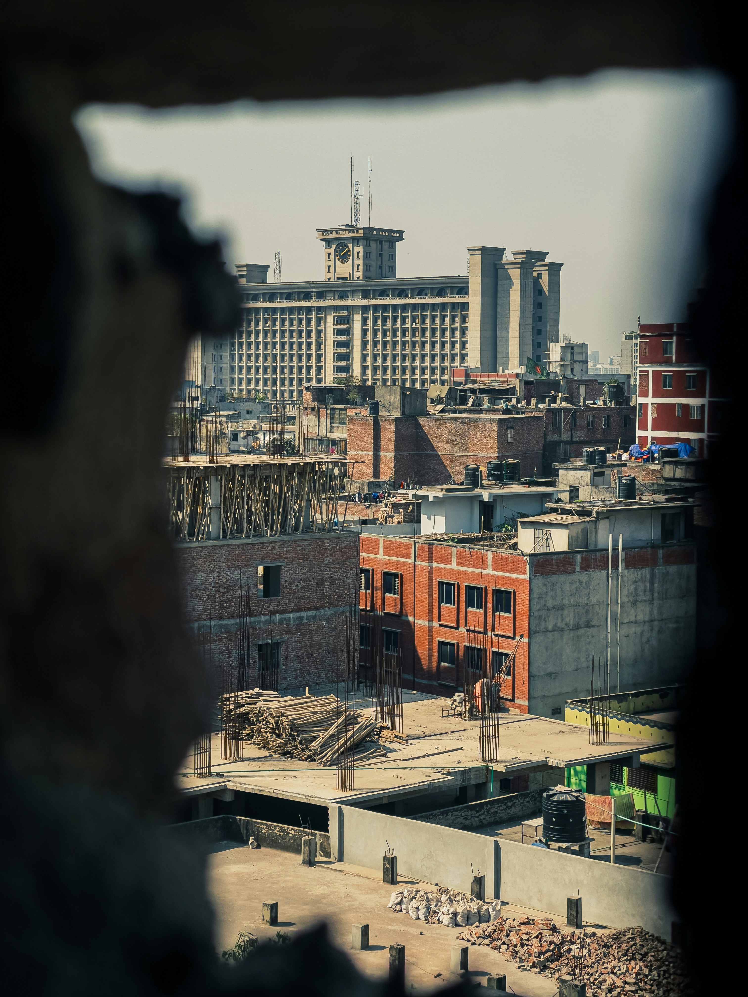 Urban Horizon Framed by Crumbling Archway