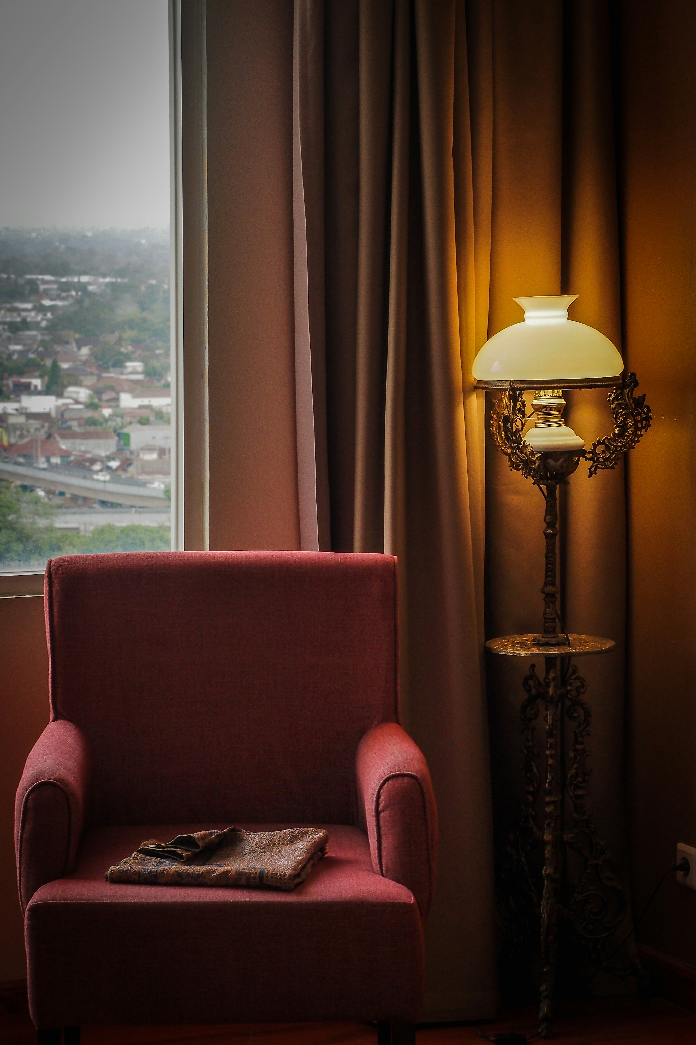 Cozy Corner: Amber Light on a Velvet Armchair