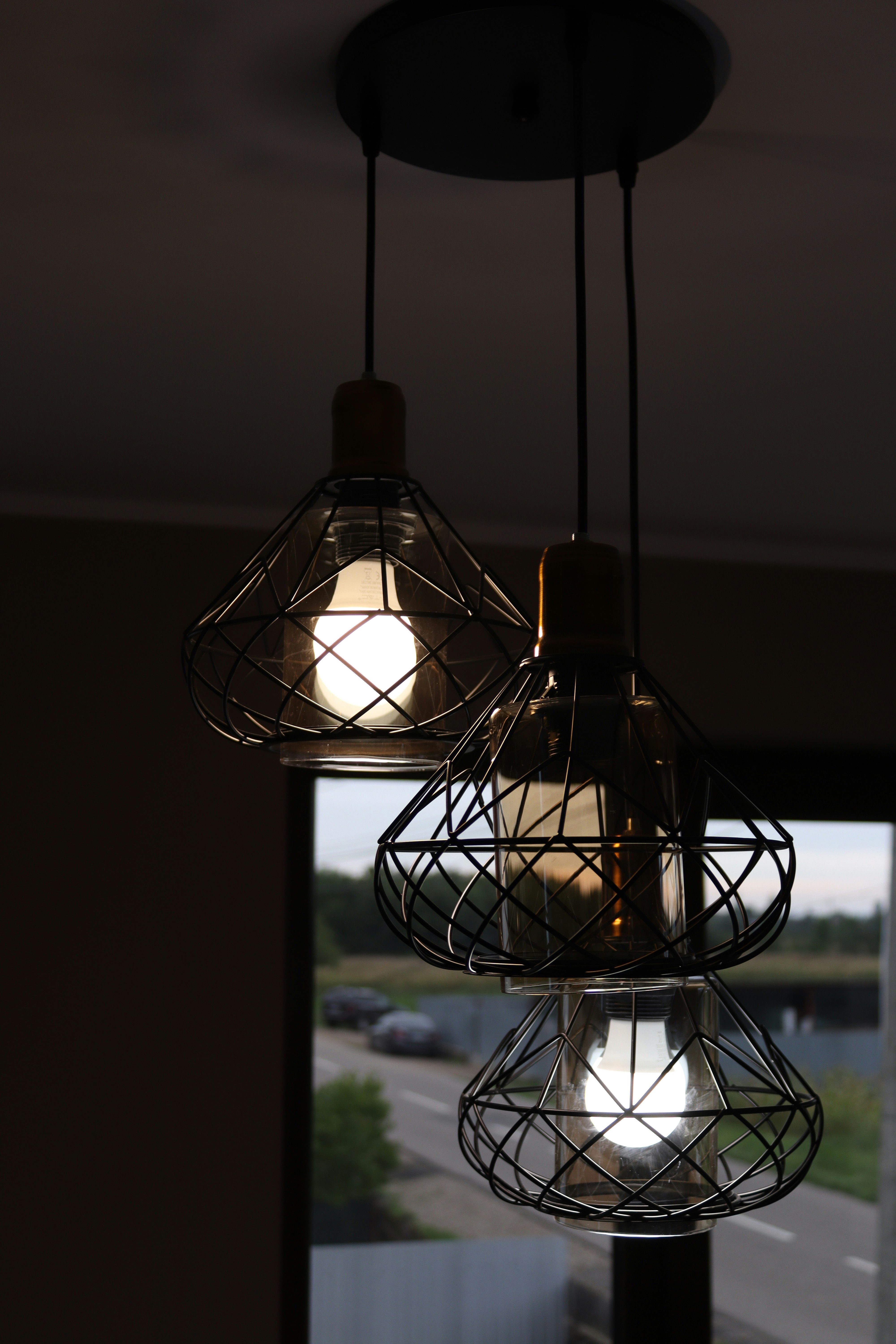 A couple of lights hanging from a ceiling photo – Free Lamp Image on ...