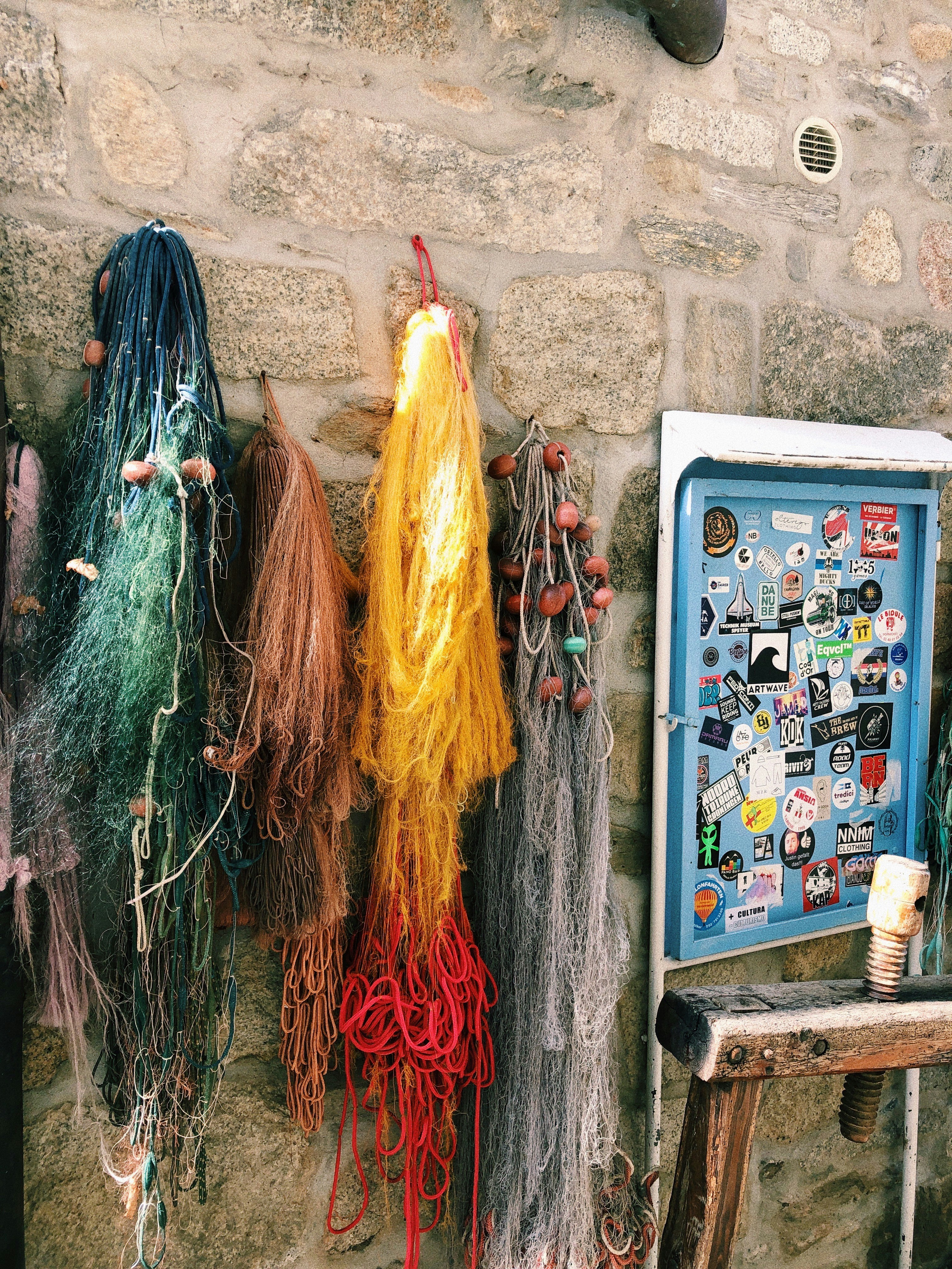 A bunch of fishing nets hanging on a wall photo – Free Italie Image on ...