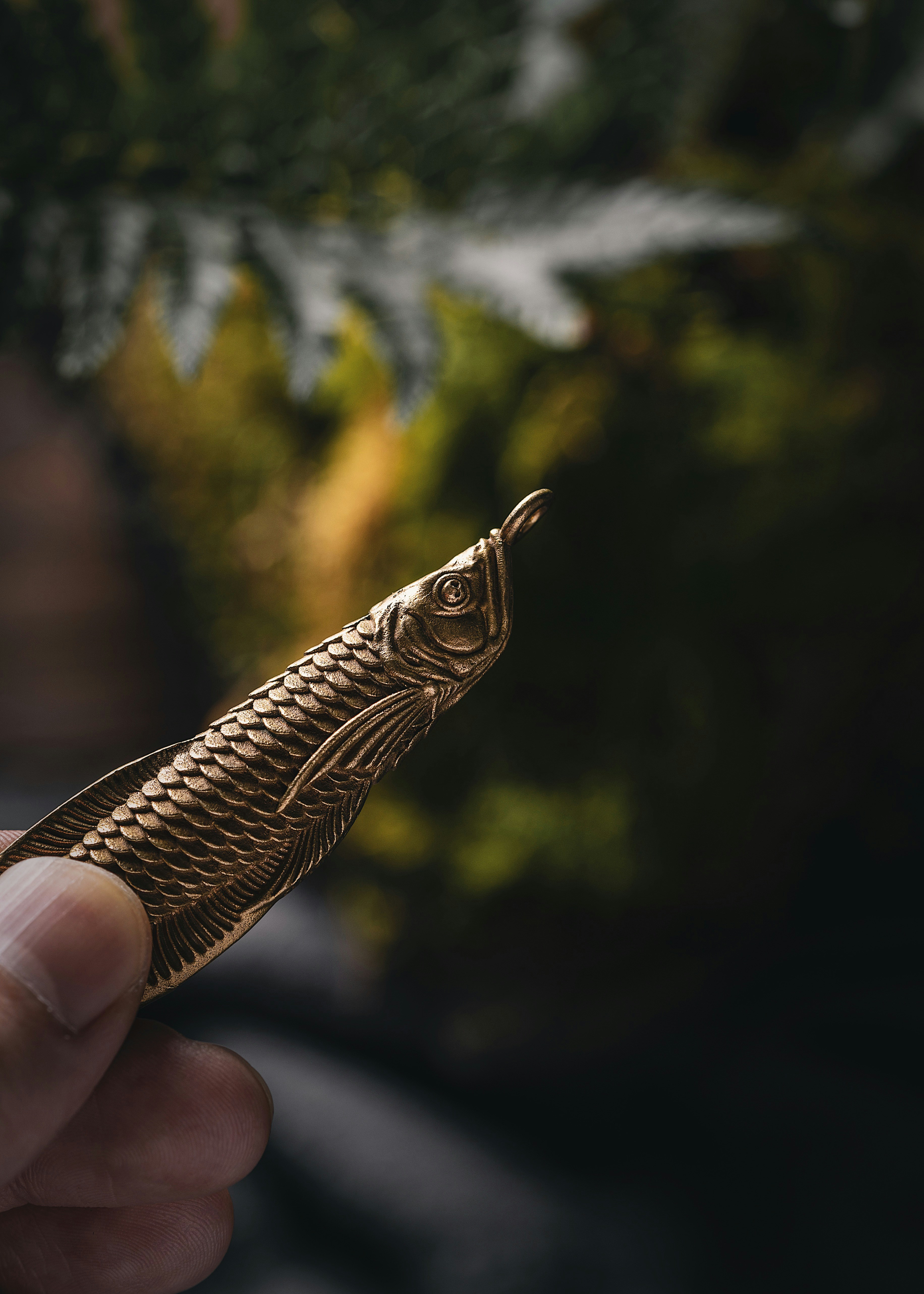 A person holding a small metal object in their hand photo – Free Finger ...