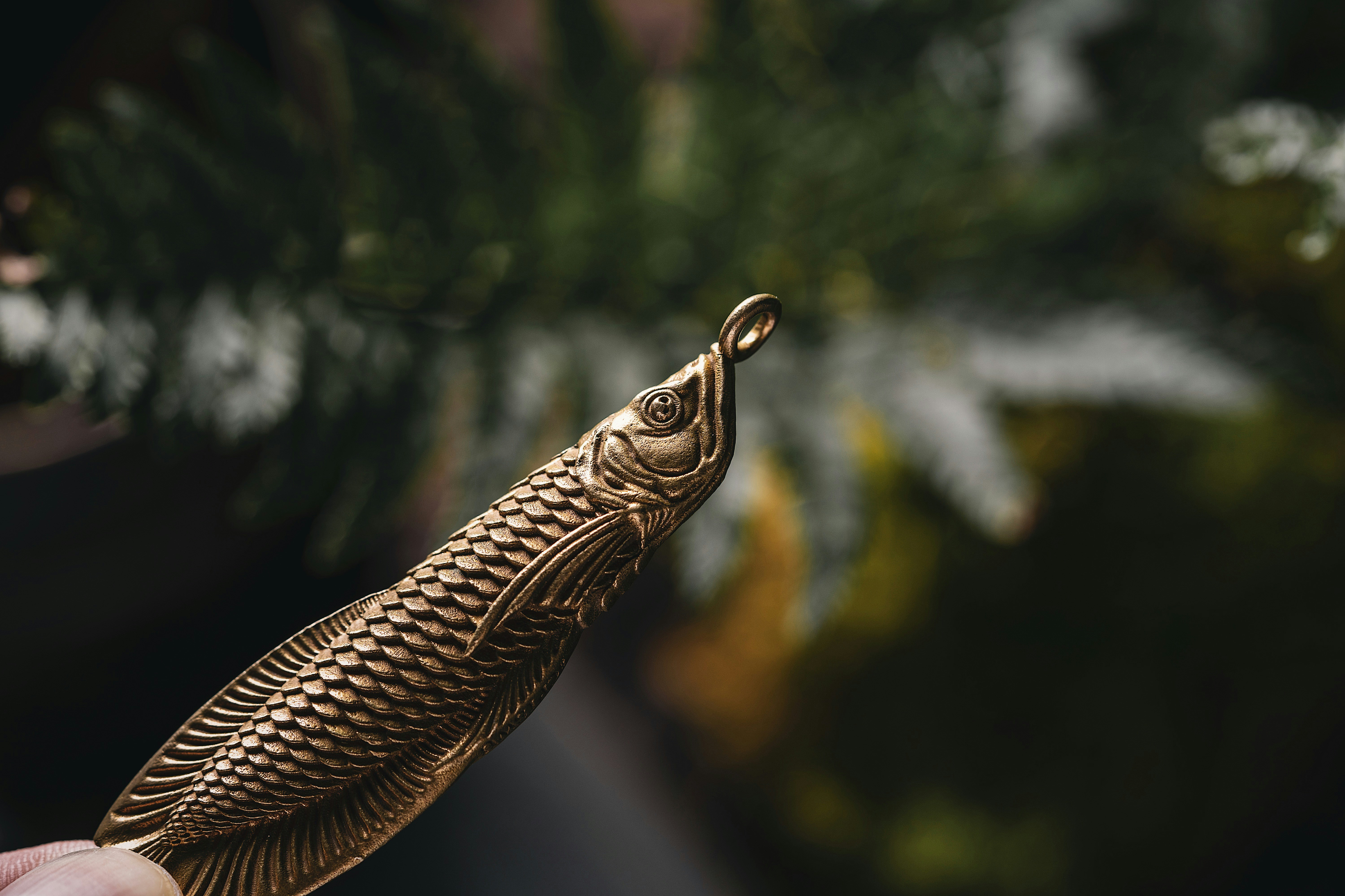 Golden Fish Keychain: A Curious Coil of Scales in Focus