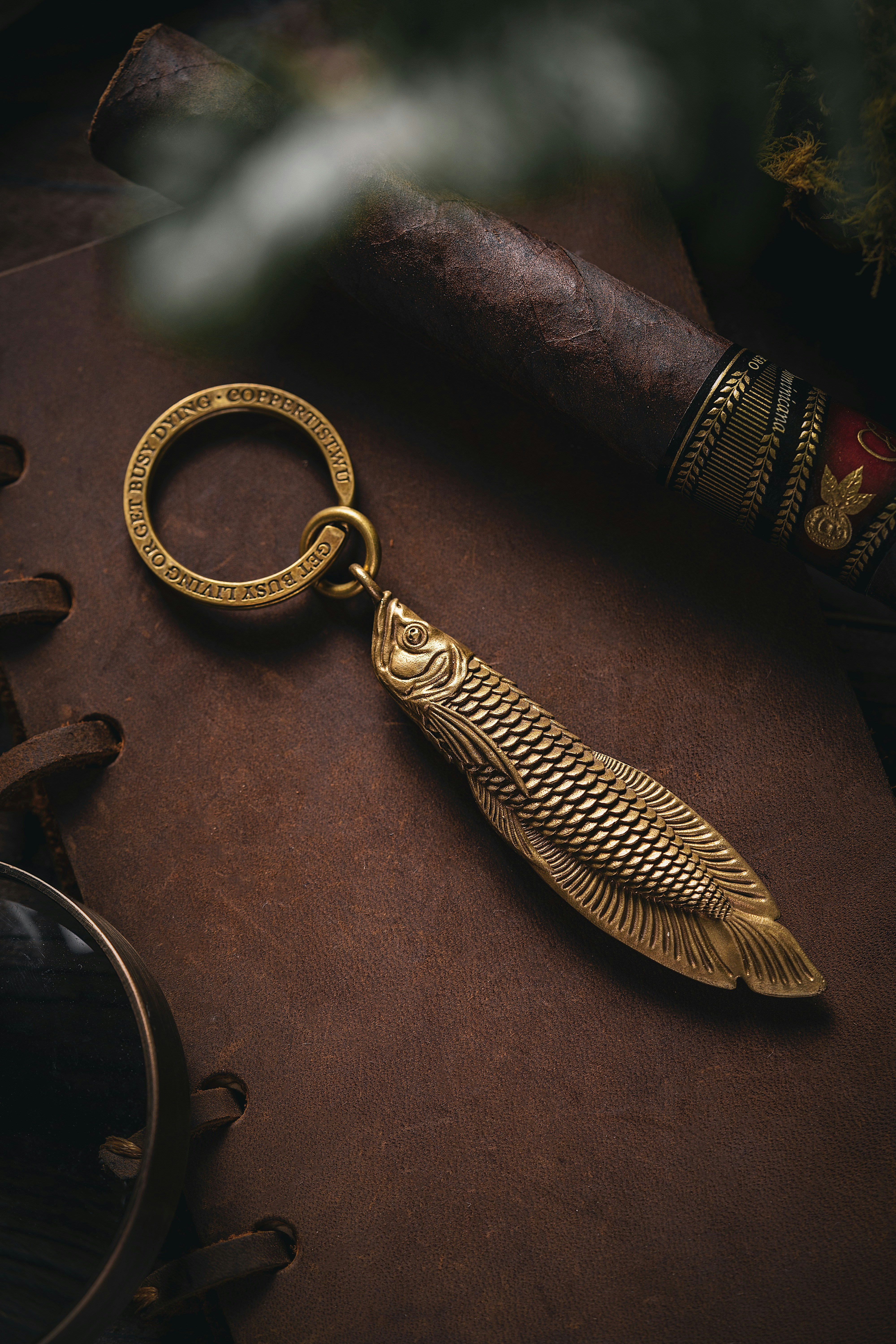 Bronze Fish Talisman on Weathered Leather: A Quiet Glint of Craft and Memory