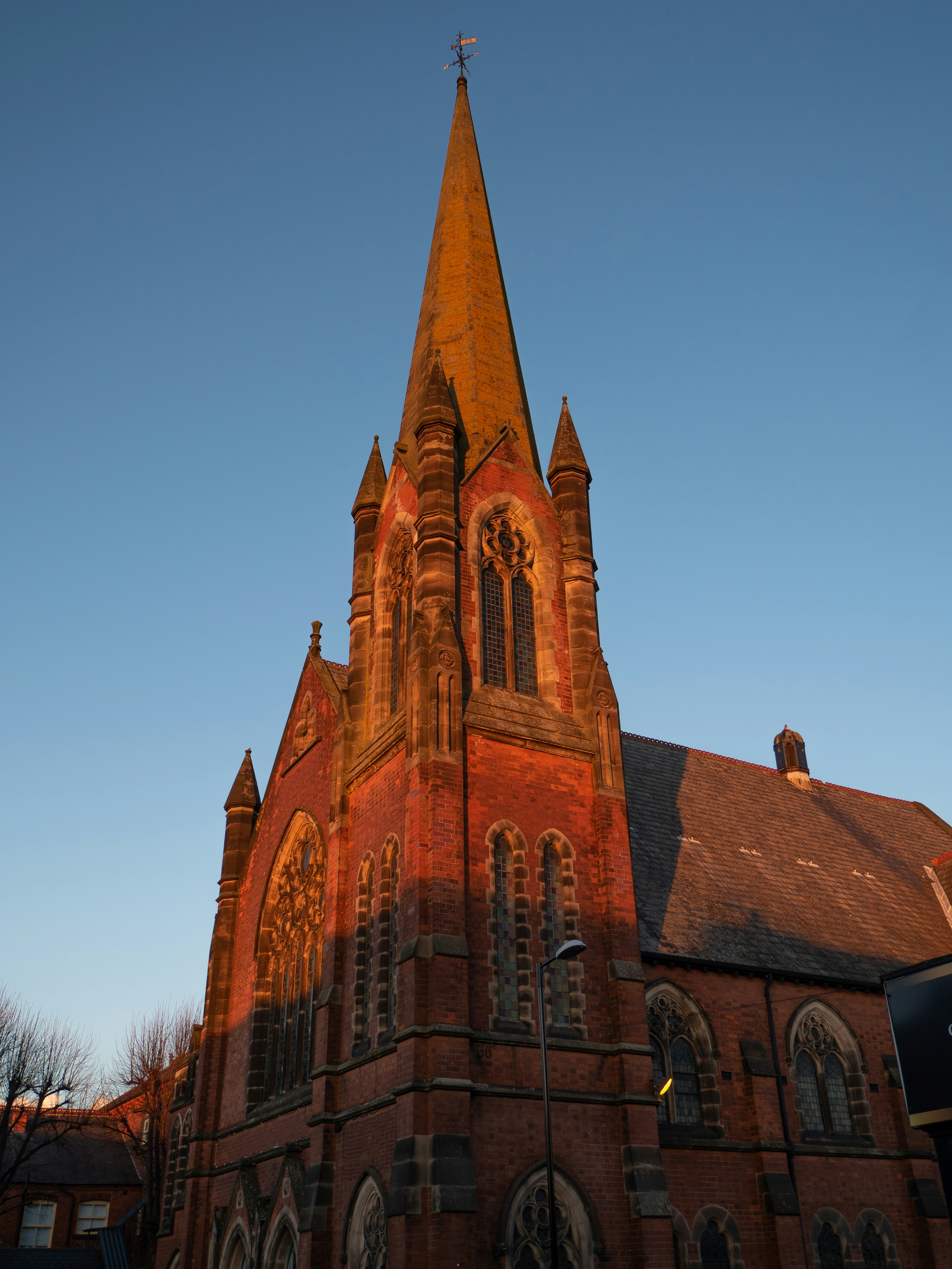 a church with a steeple and a clock tower