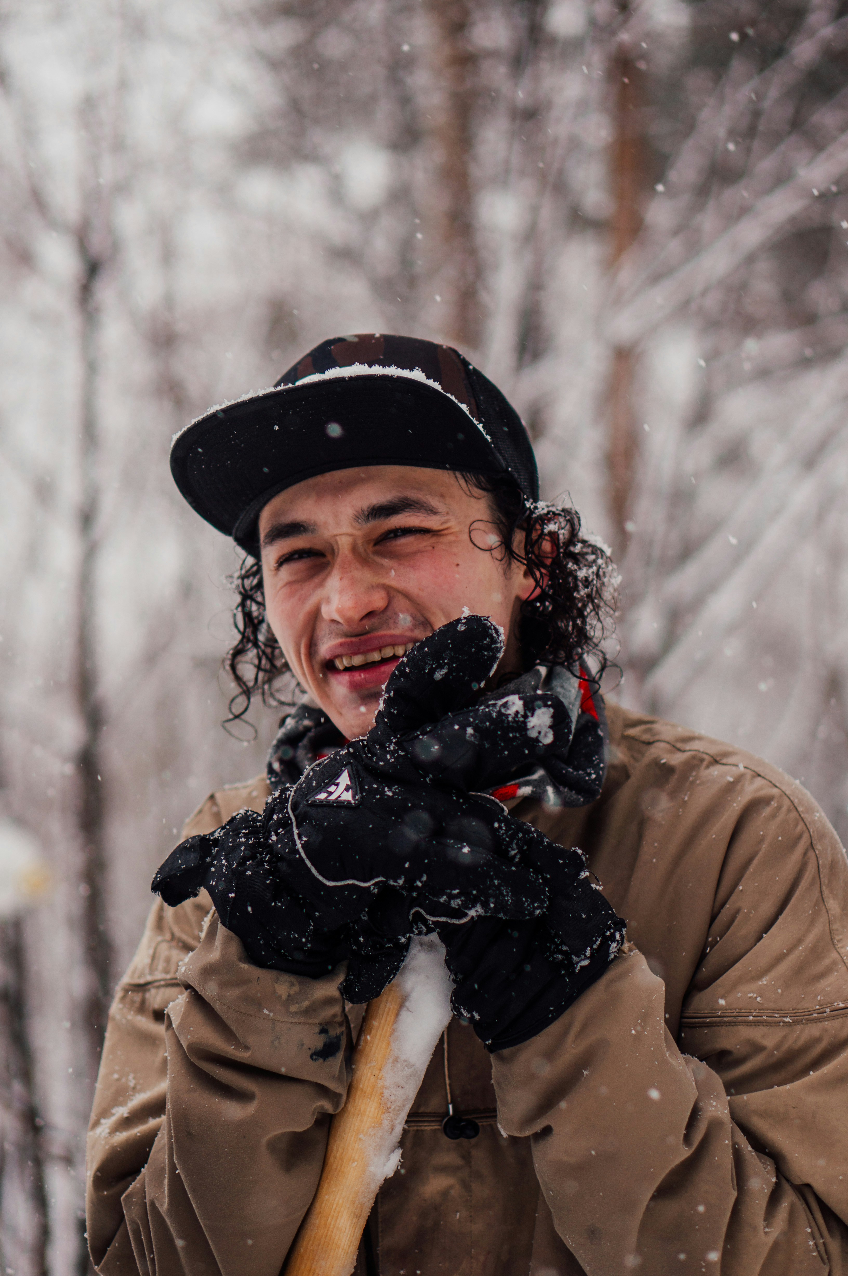 A man holding a baseball bat in the snow photo – Free Outdoors Image on ...