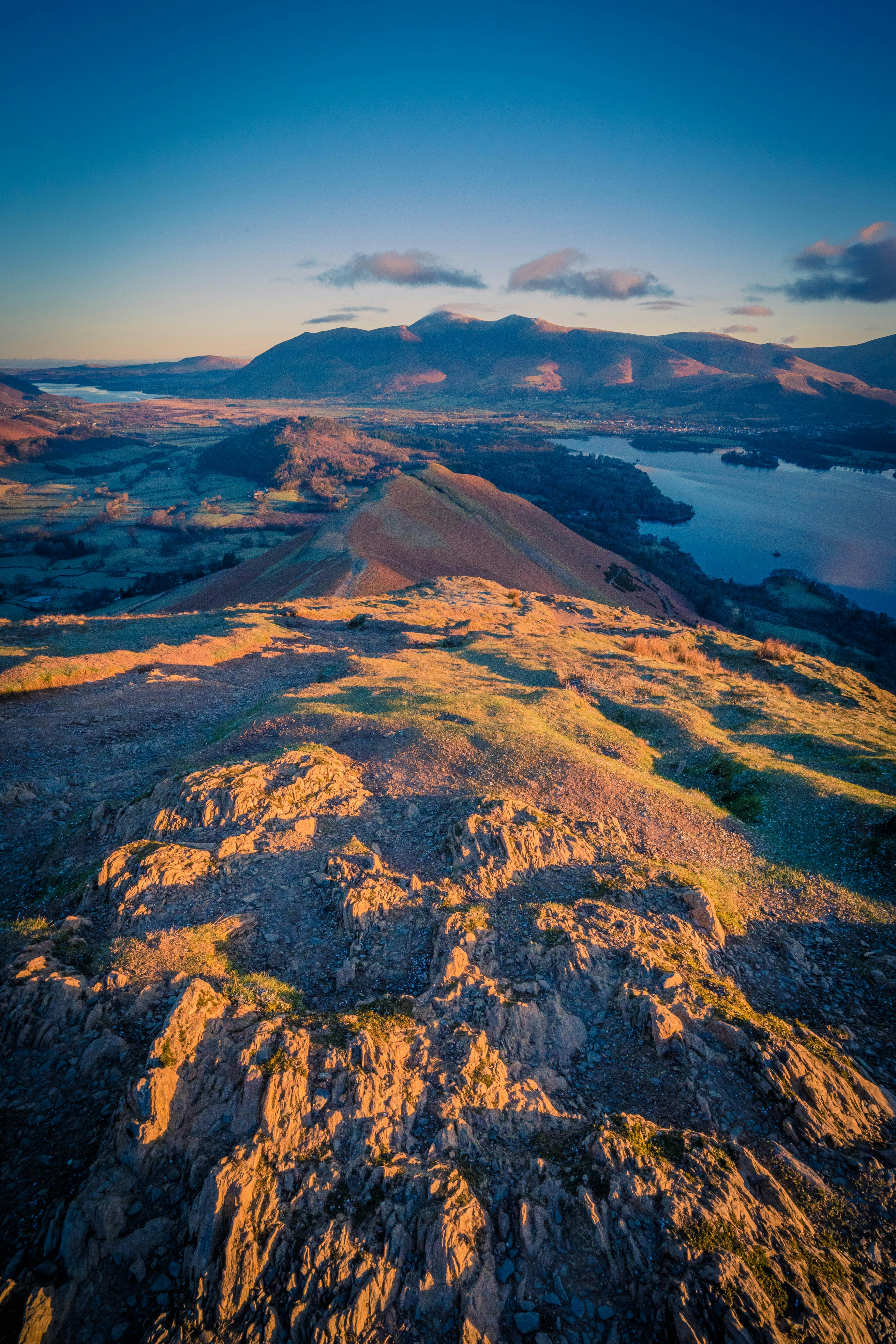 A view of a mountain range with a body of water in the distance photo ...