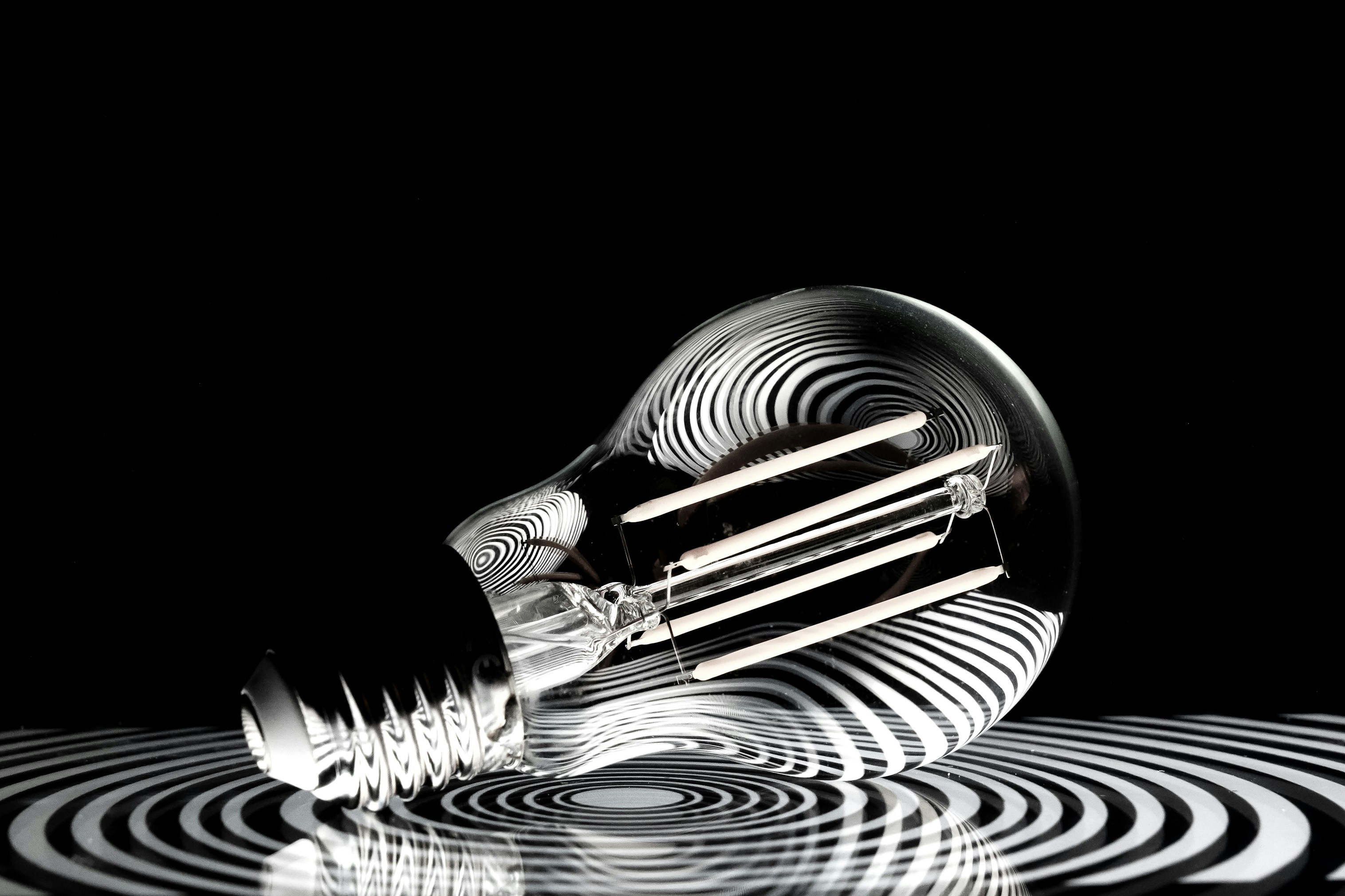 Reflections in a Lighted Spiral: A Glass Lamp on Liquid Circles