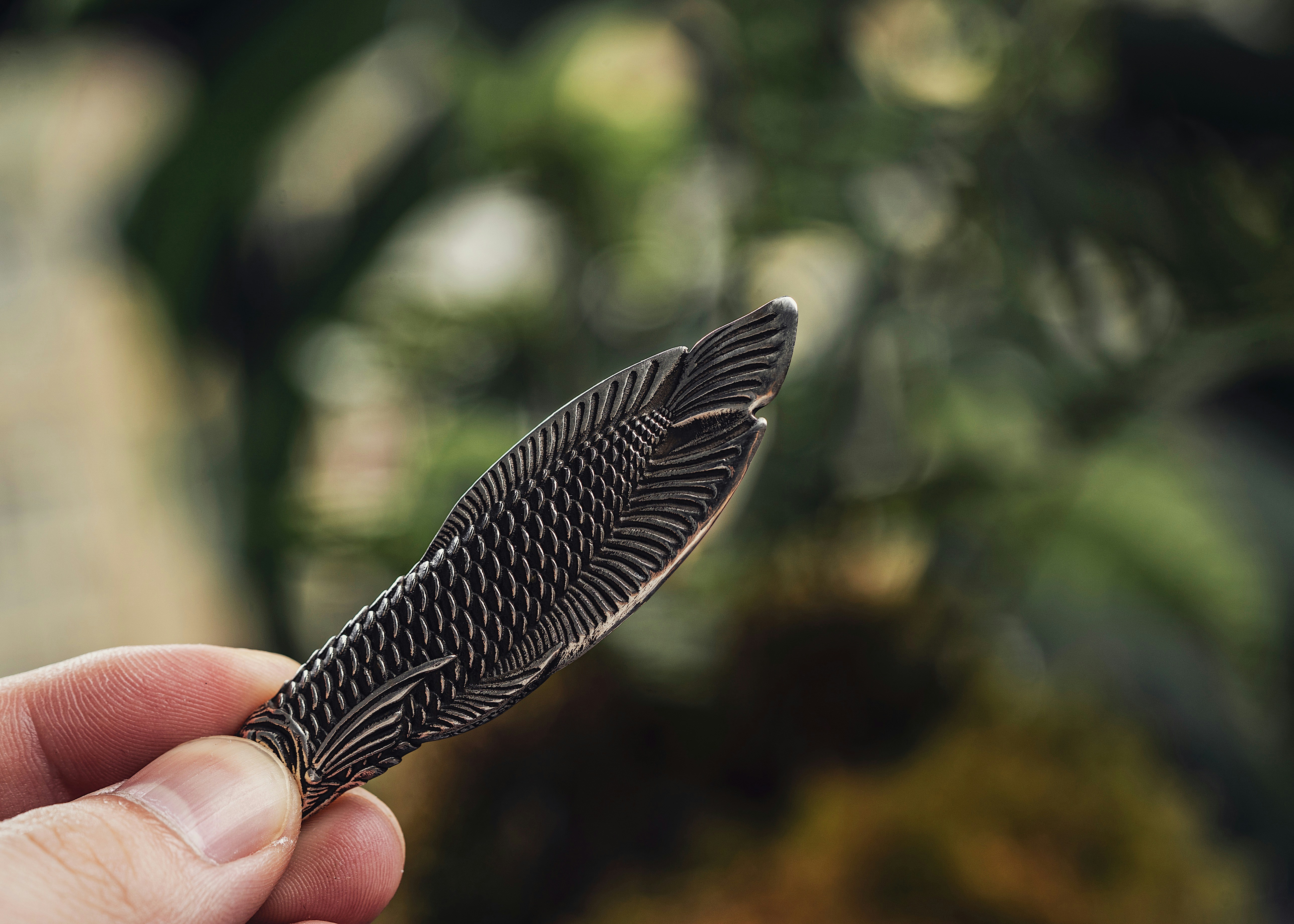 A person holding a small metal object in their hand photo – Free Animal ...
