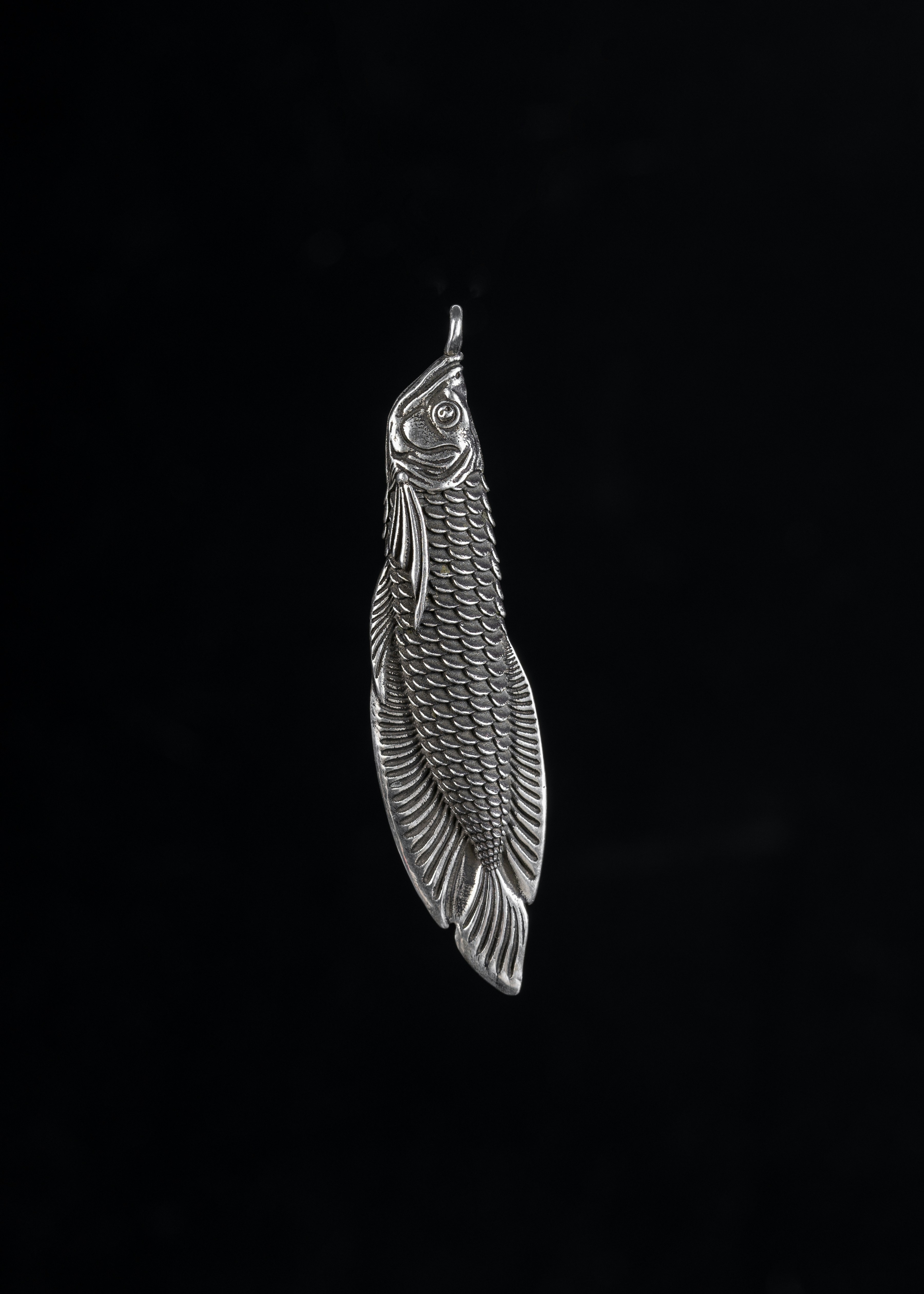 A silver bird ornament on a black background photo – Free Animal Image ...