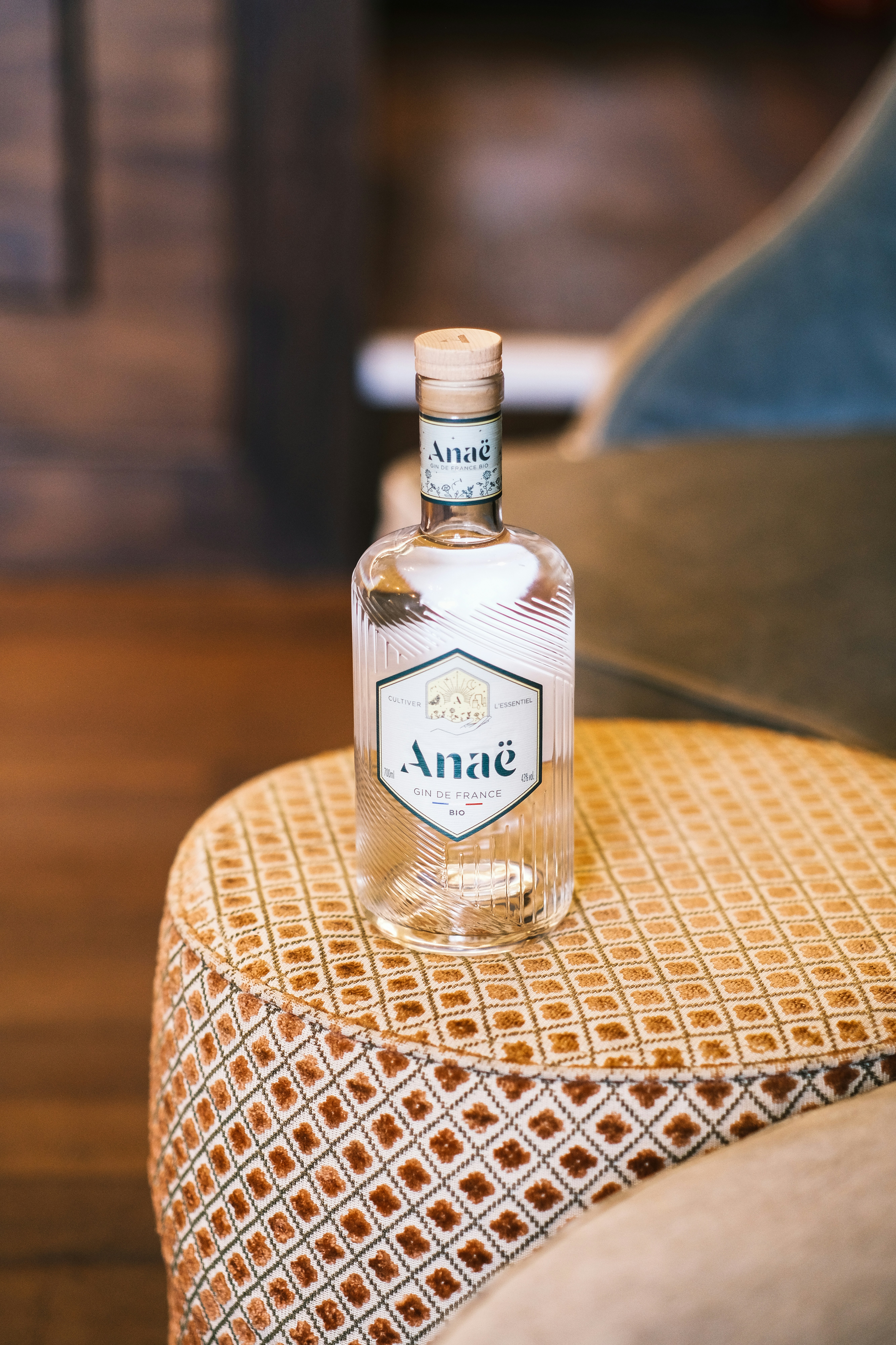 Gin on a Stool: A Quiet Portrait of Anaïe on a Checker-Patterned Seat