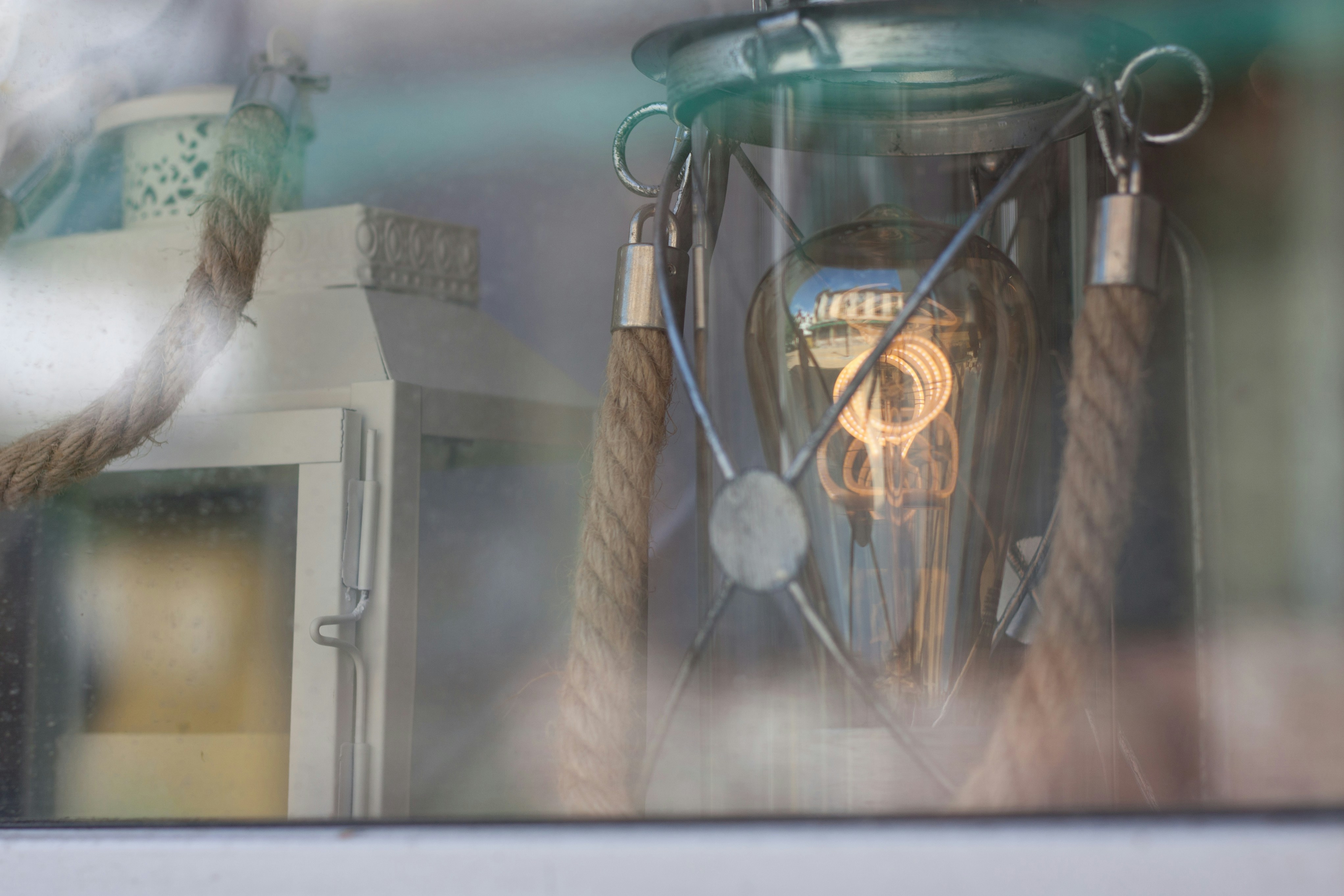 Hidden Glow: An Edison Lantern Behind Glass