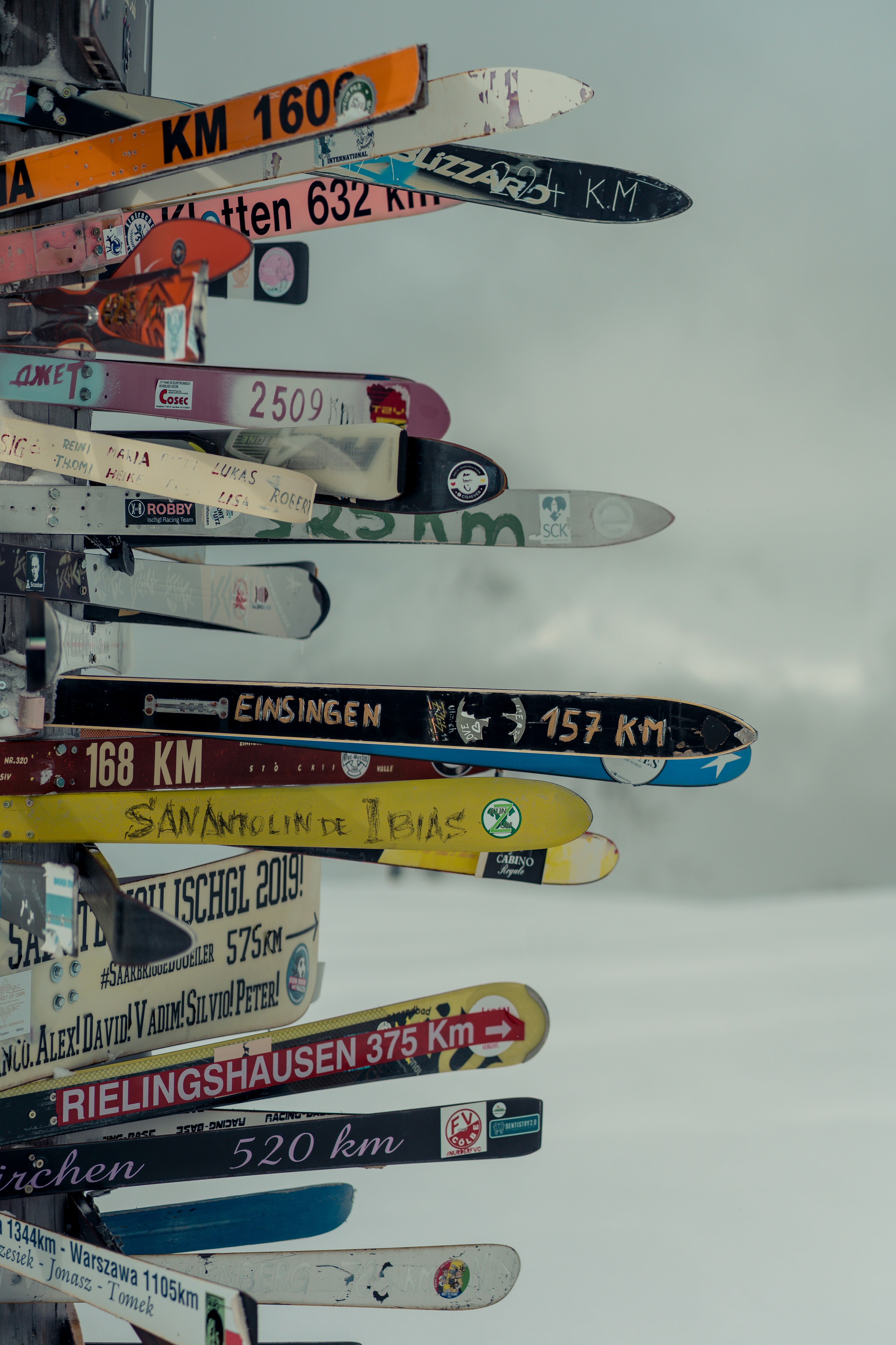 A bunch of skis are stacked on top of each other photo – Free Mountains ...