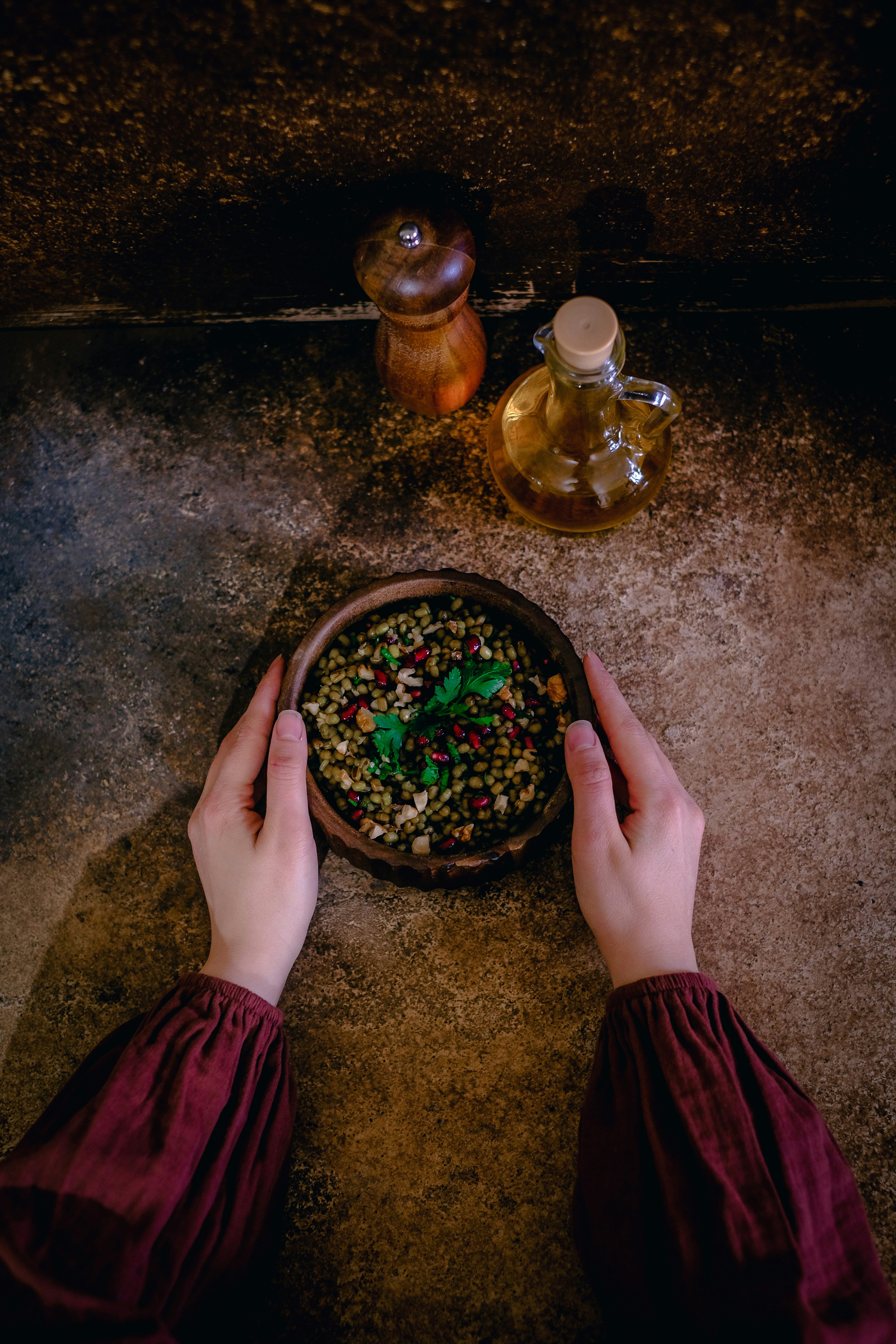 Top-Down Stillness: A Seed Bowl Cradled by Gentle Hands