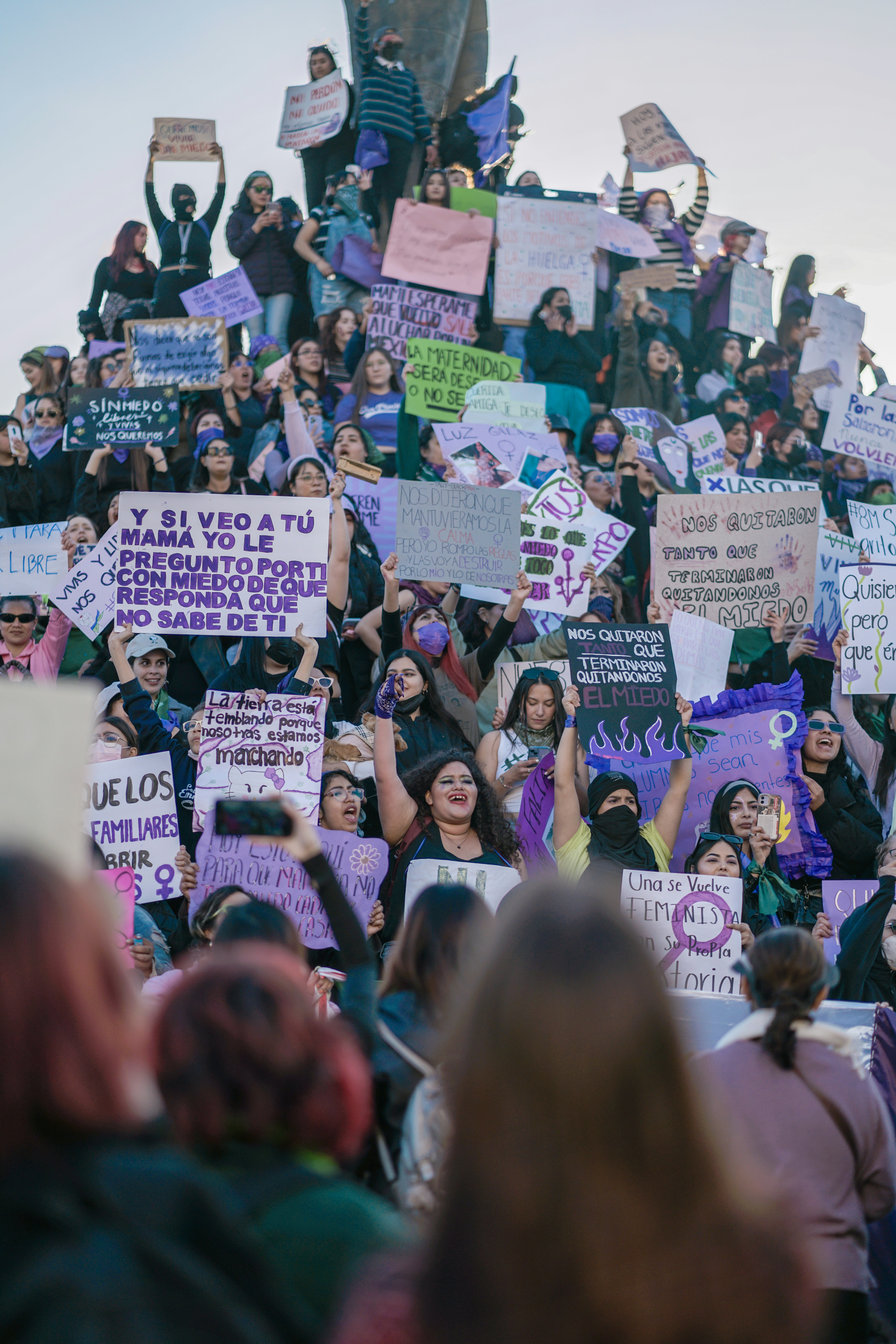 A large group of people holding up signs photo – Free Female Image on ...