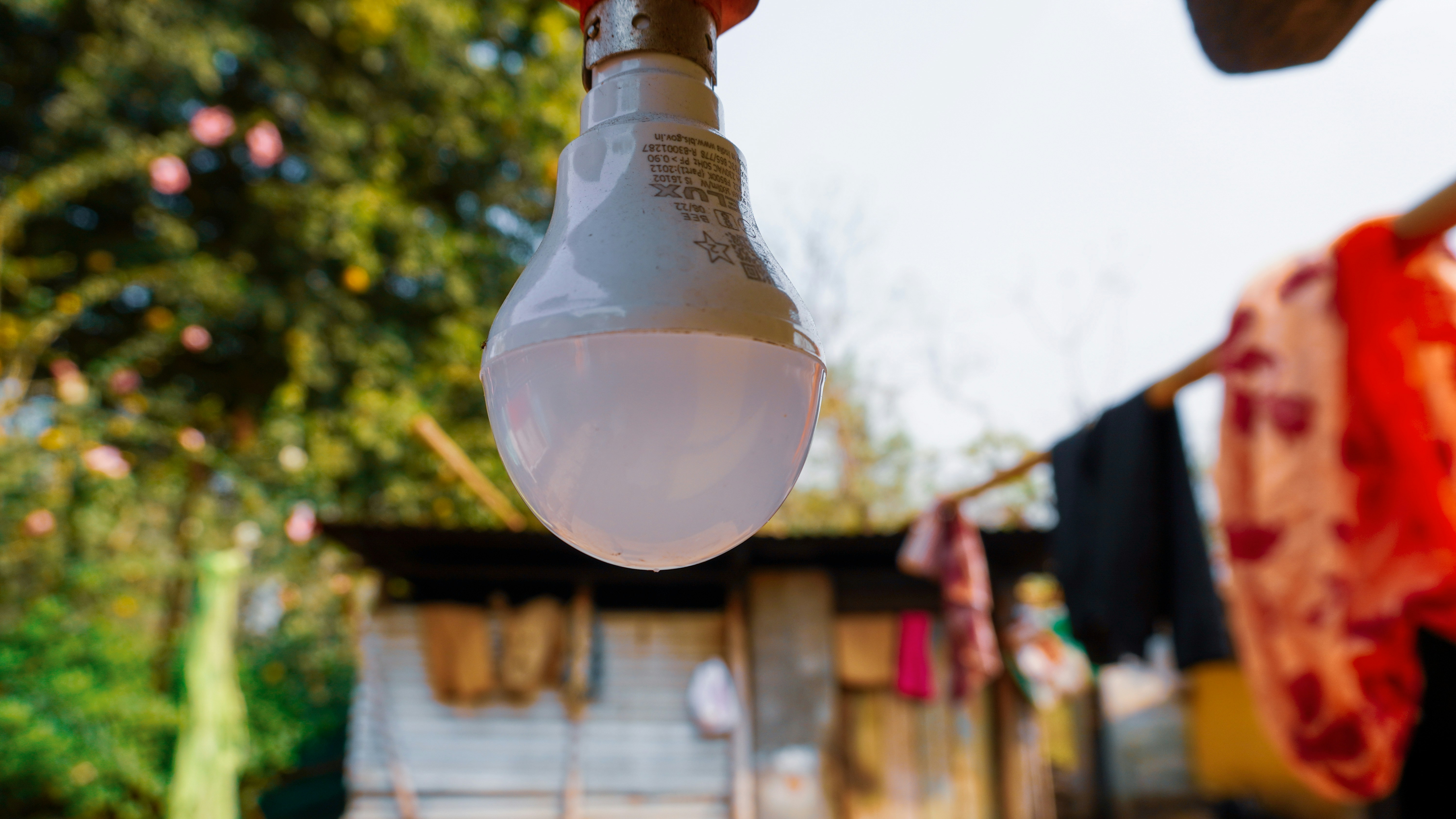 A light bulb hanging from a clothes line photo – Free Light Image on ...