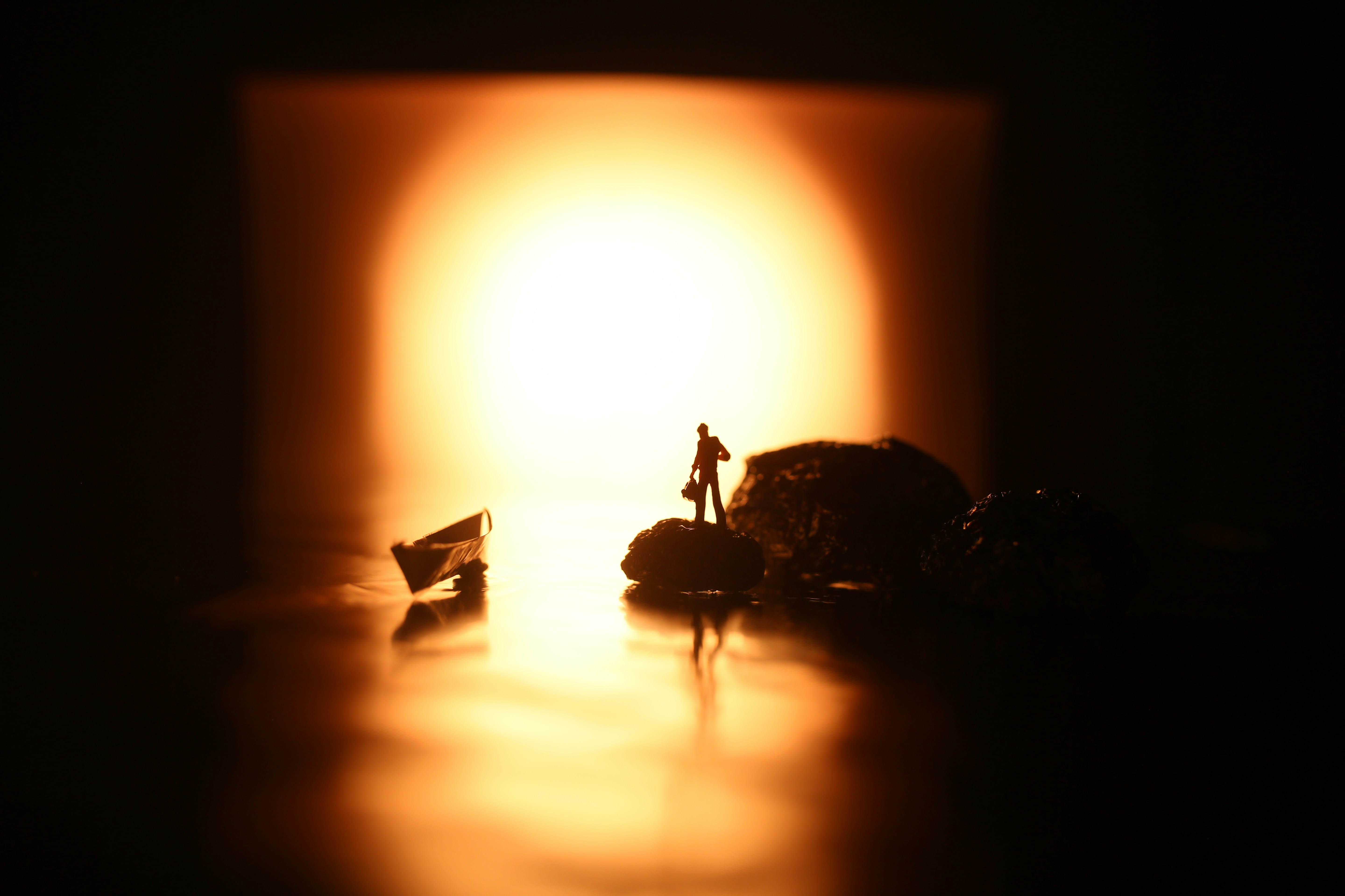 Silhouette at the Fiery Horizon: A Tiny Figure, Big Light
