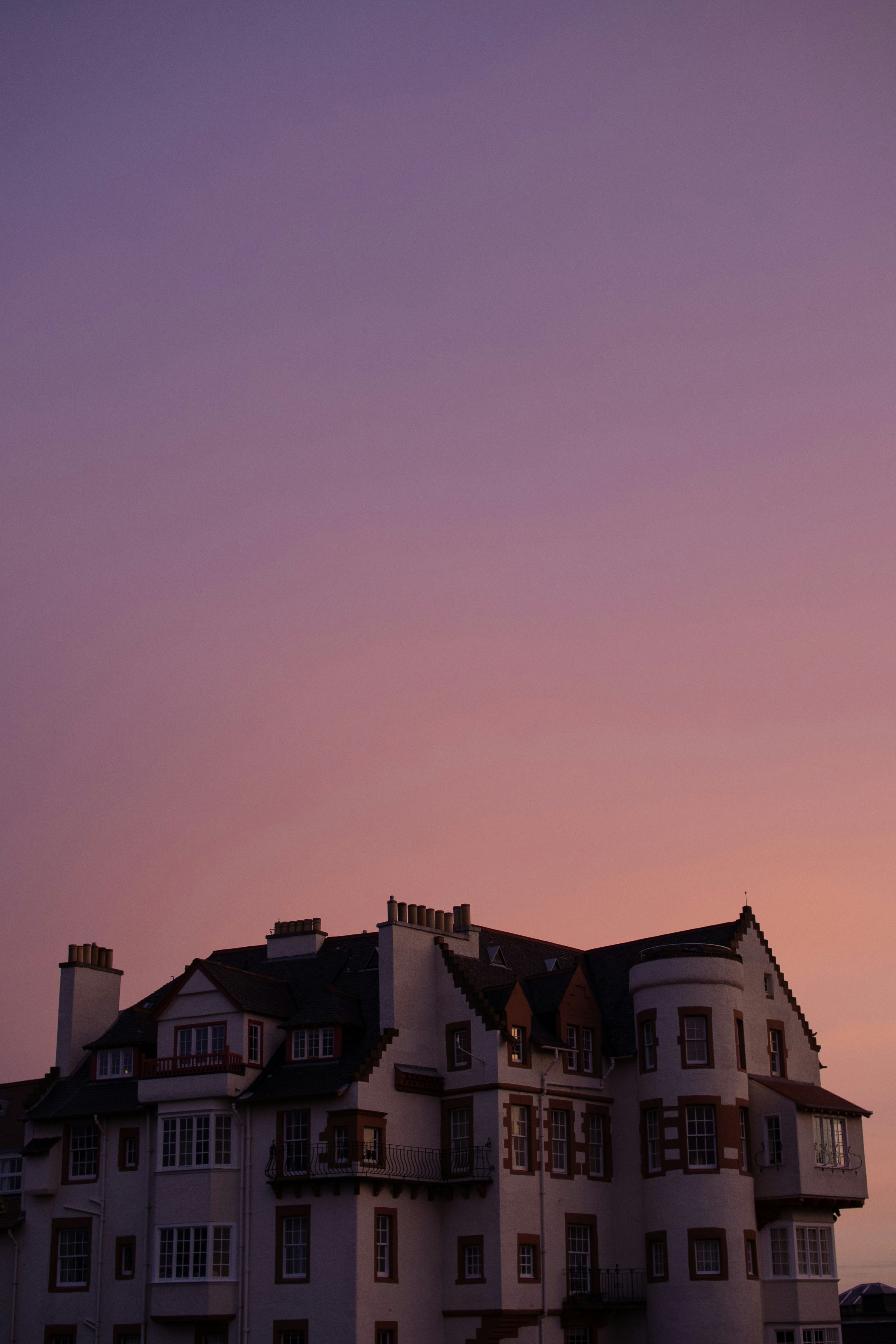Twilight over Turrets: Sunset Cloaks a Victorian-Style Apartment Block