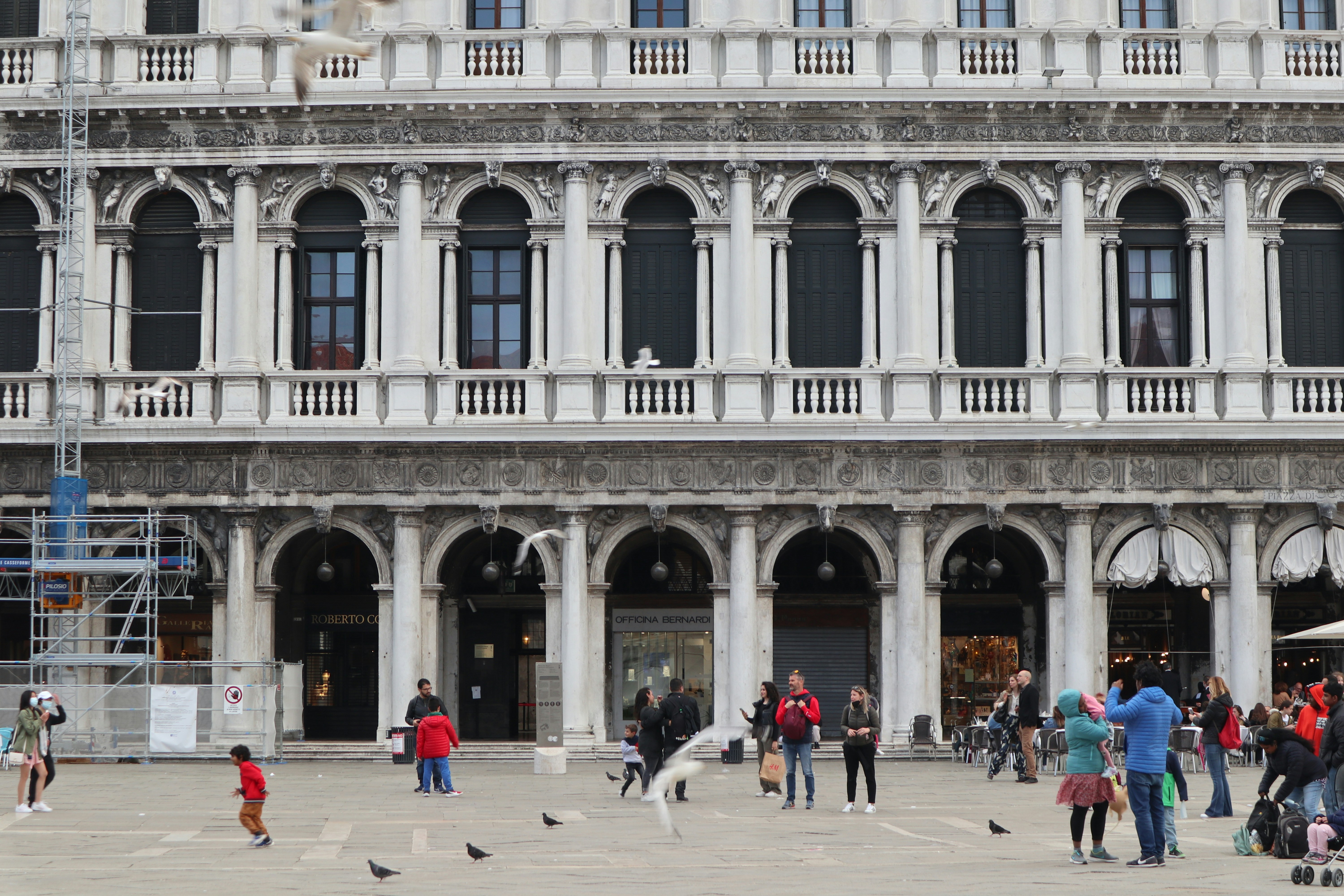 Arcaded Grandeur: A Busy Piazza Before a Renaissance Facade