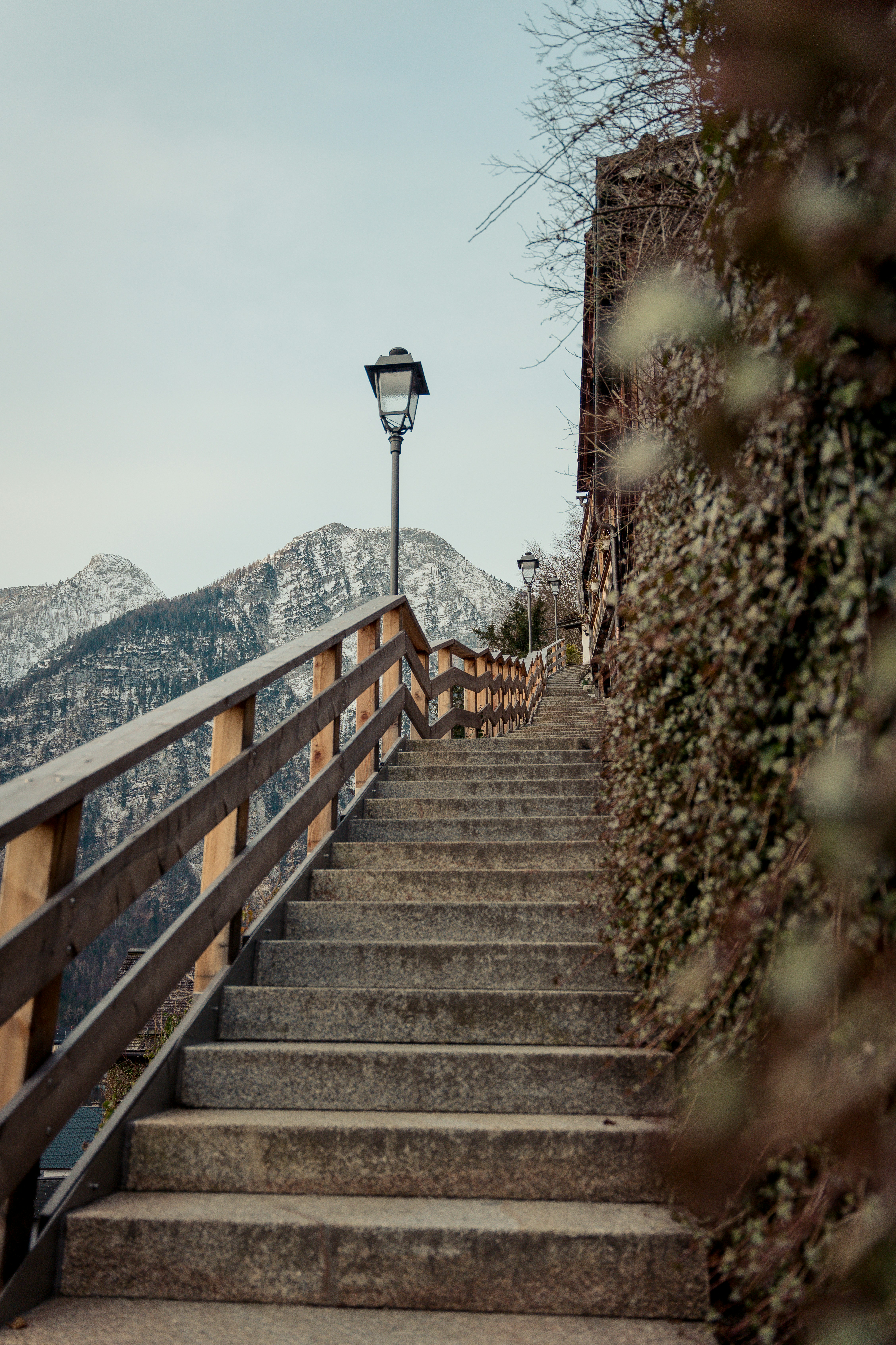 Lamppost Ascent: A Snow-Dusted Staircase Toward the Alpine Ridge