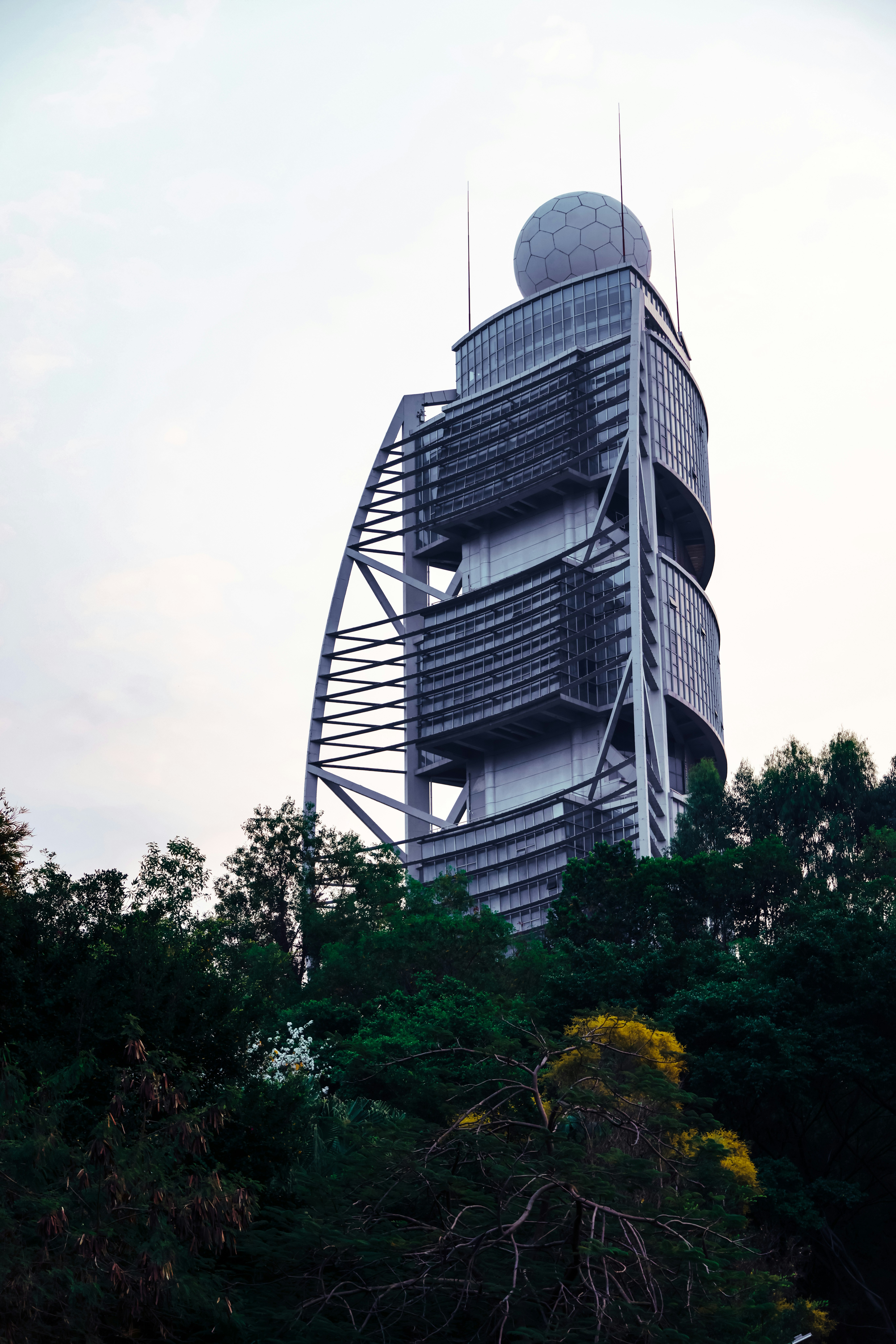 a tall building with a spiral staircase on top of it
