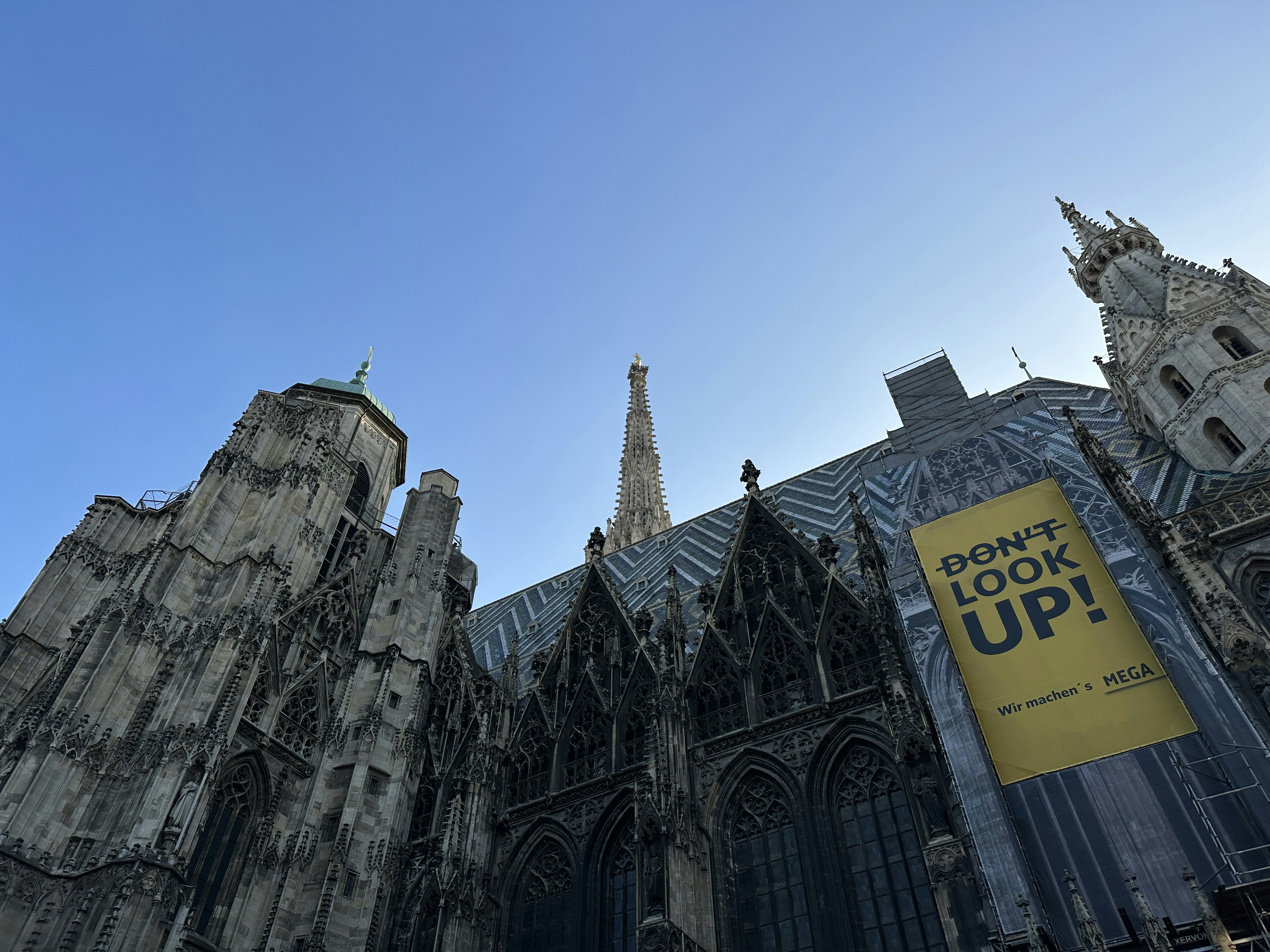 A very tall cathedral with a sign in front of it photo – Free Innere ...