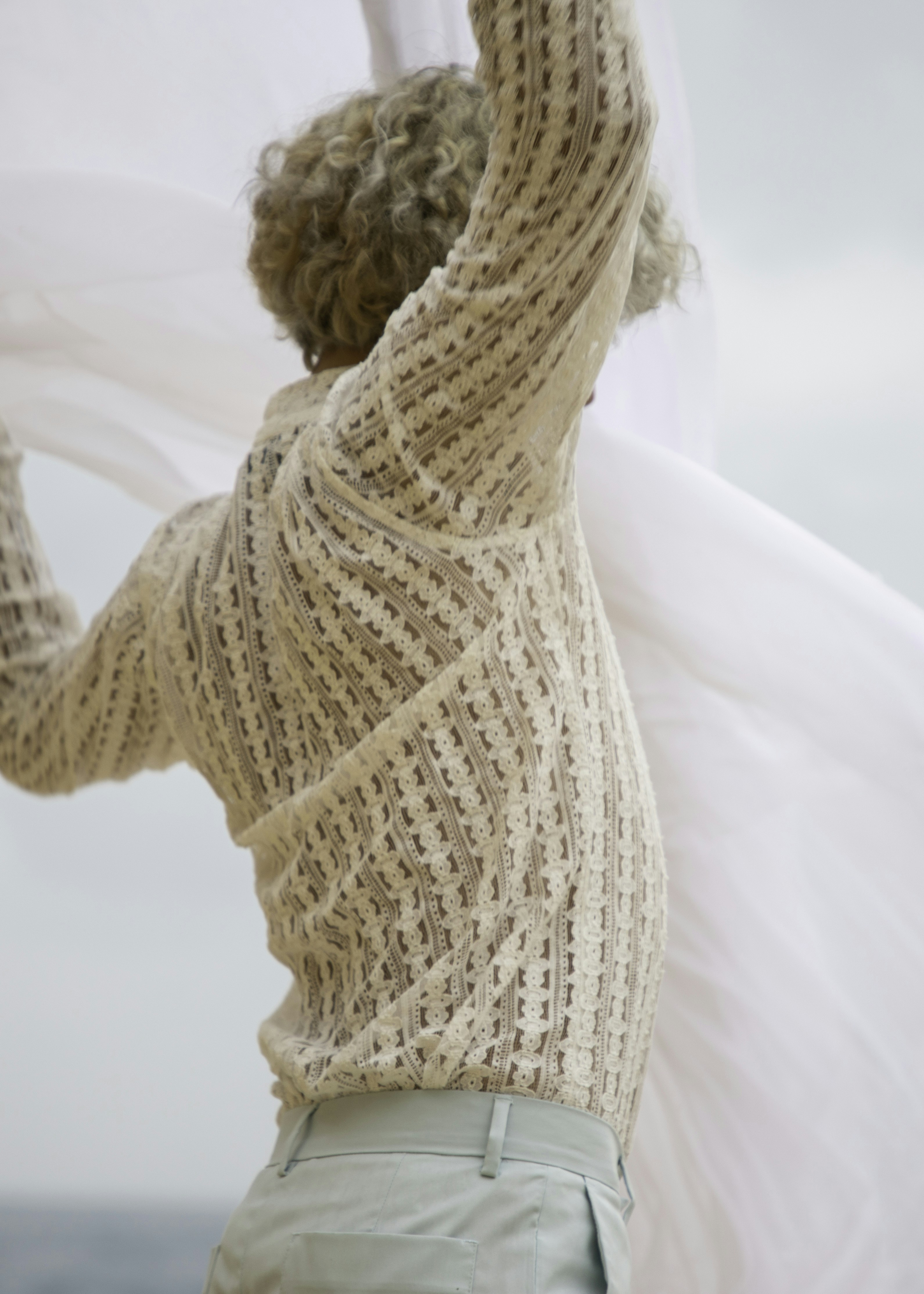 A man holding a white cloth over his head photo – Free Man alone Image ...