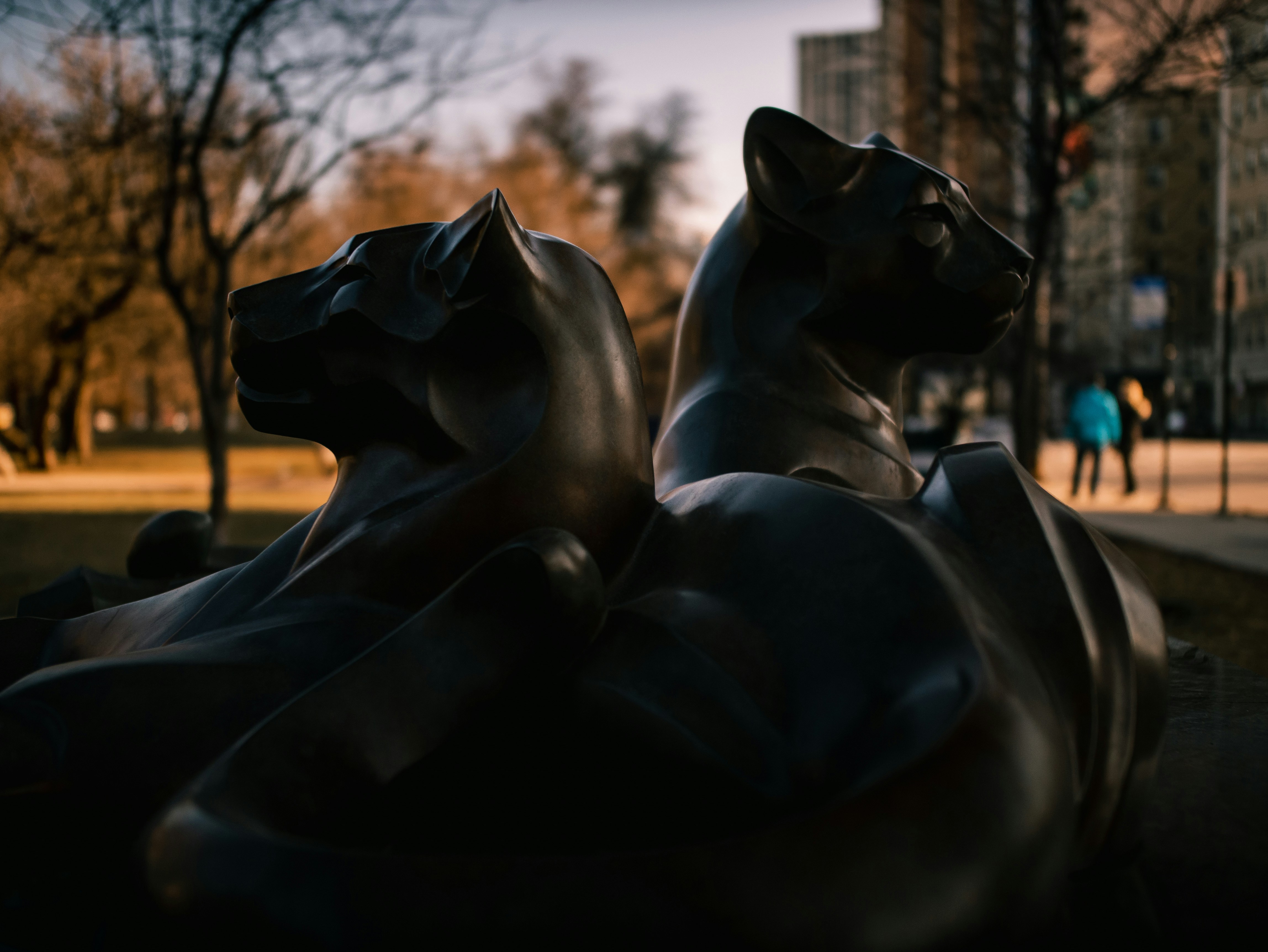Grazing in the Park: Dual Horse Statues in Evening Light