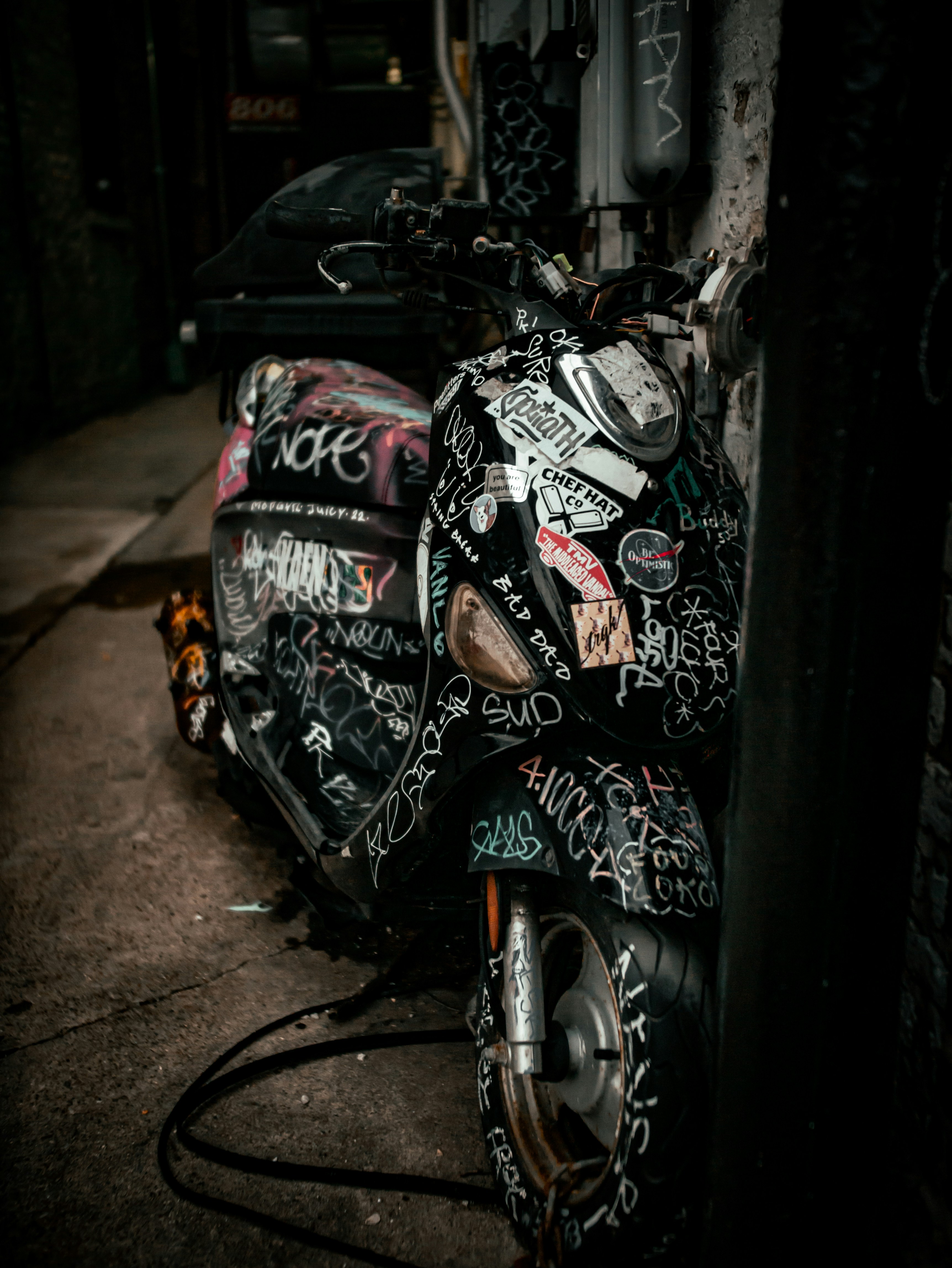 Graffiti-Stained Scooter: A Mocha Alley Portrait