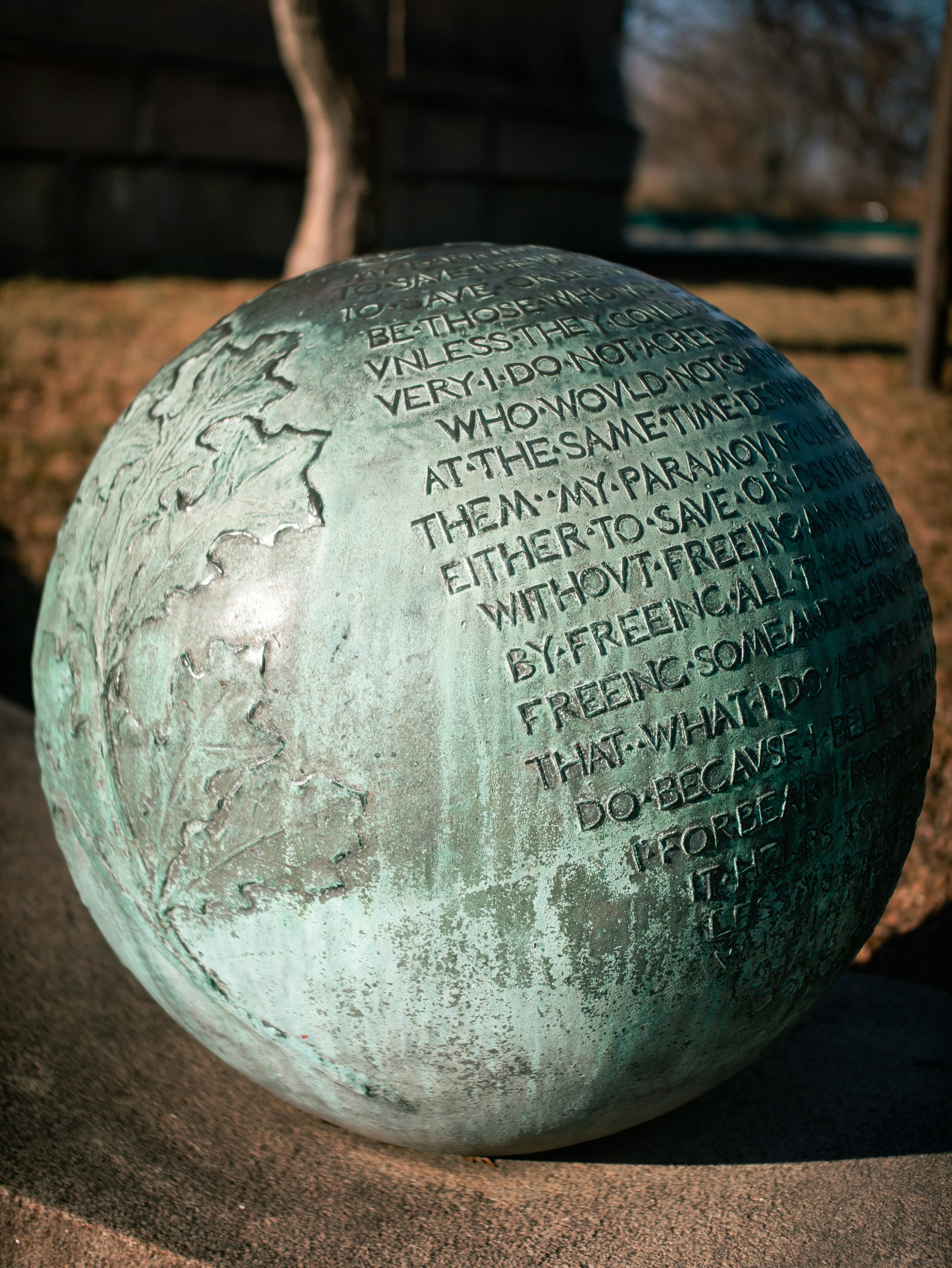 a large metal ball with writing on it
