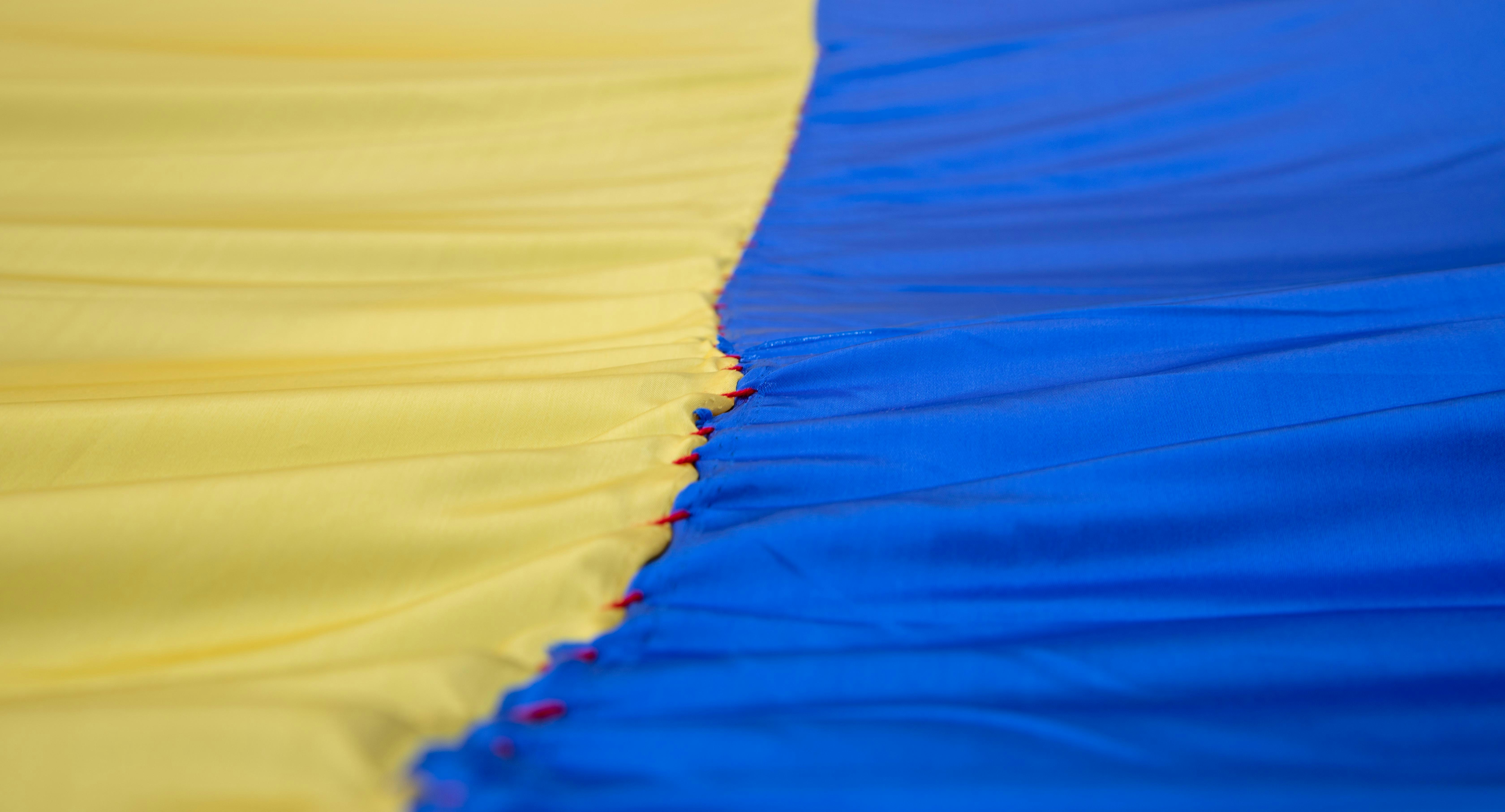 Crimson Seam: A Close-Up Where Yellow Meets Blue