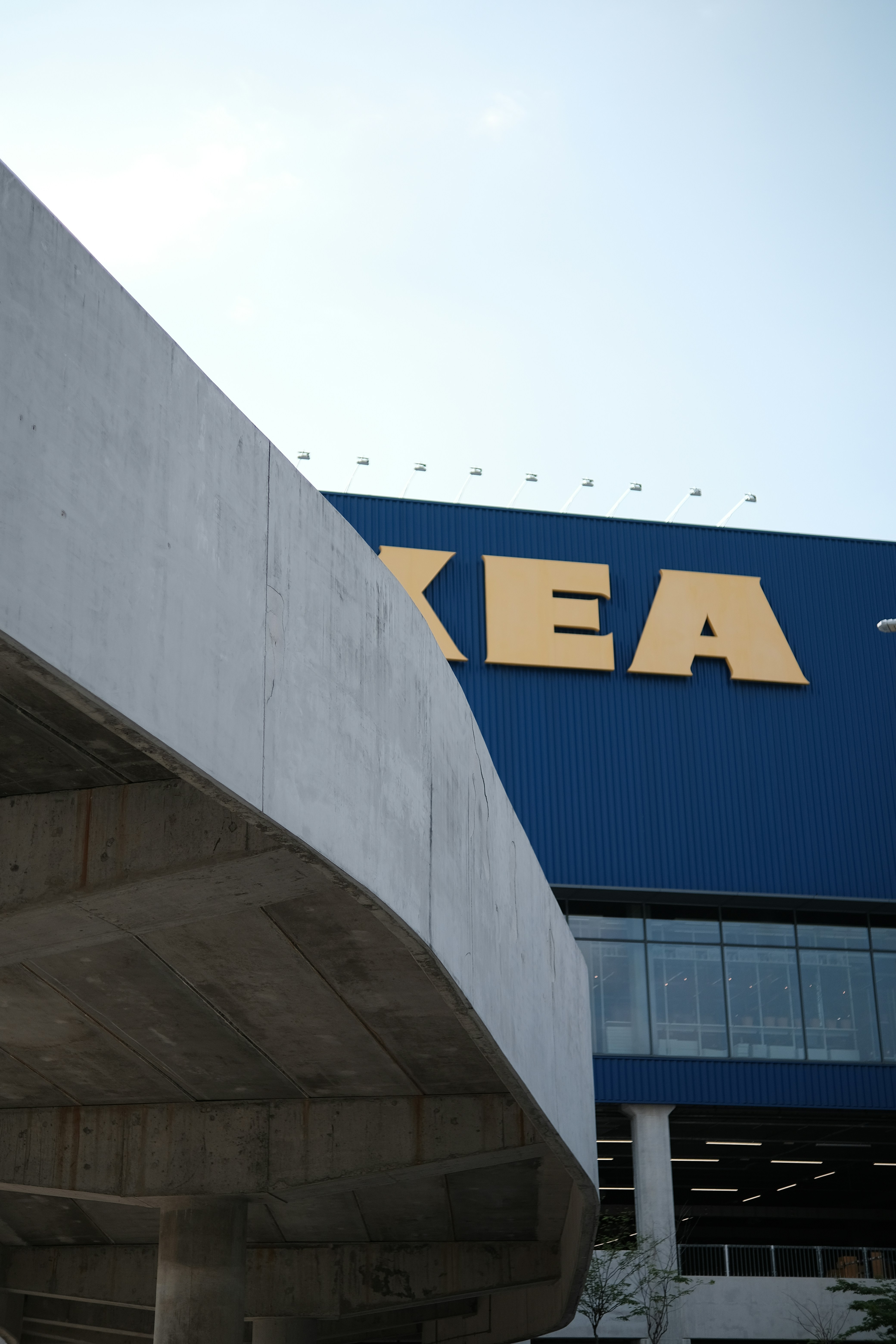 Cobalt Wall Meets Concrete Canopy: An IKEA Sign Architectural Moment