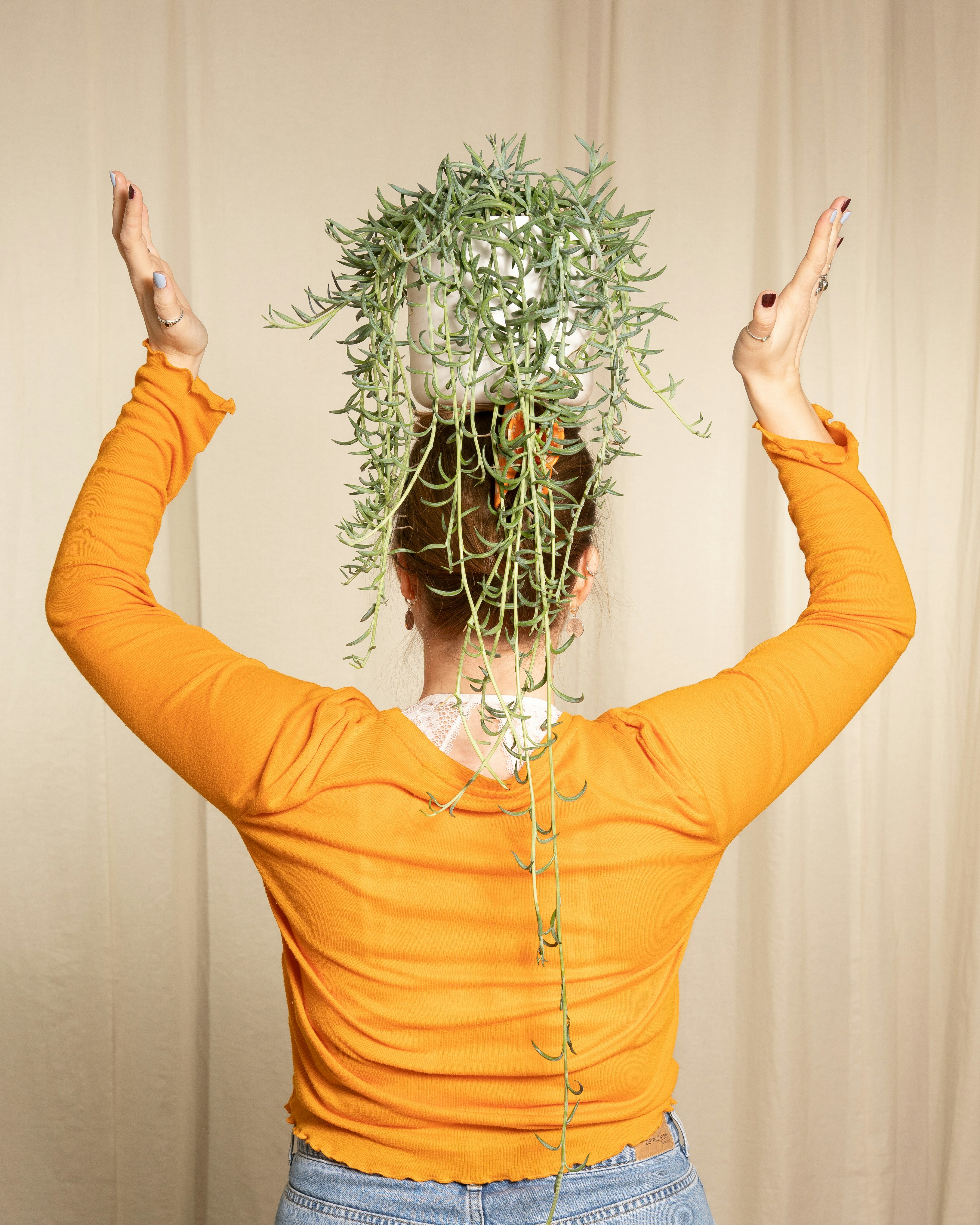 Portrait of a Plant-Top Performer: A Person with Green Trailing Hair