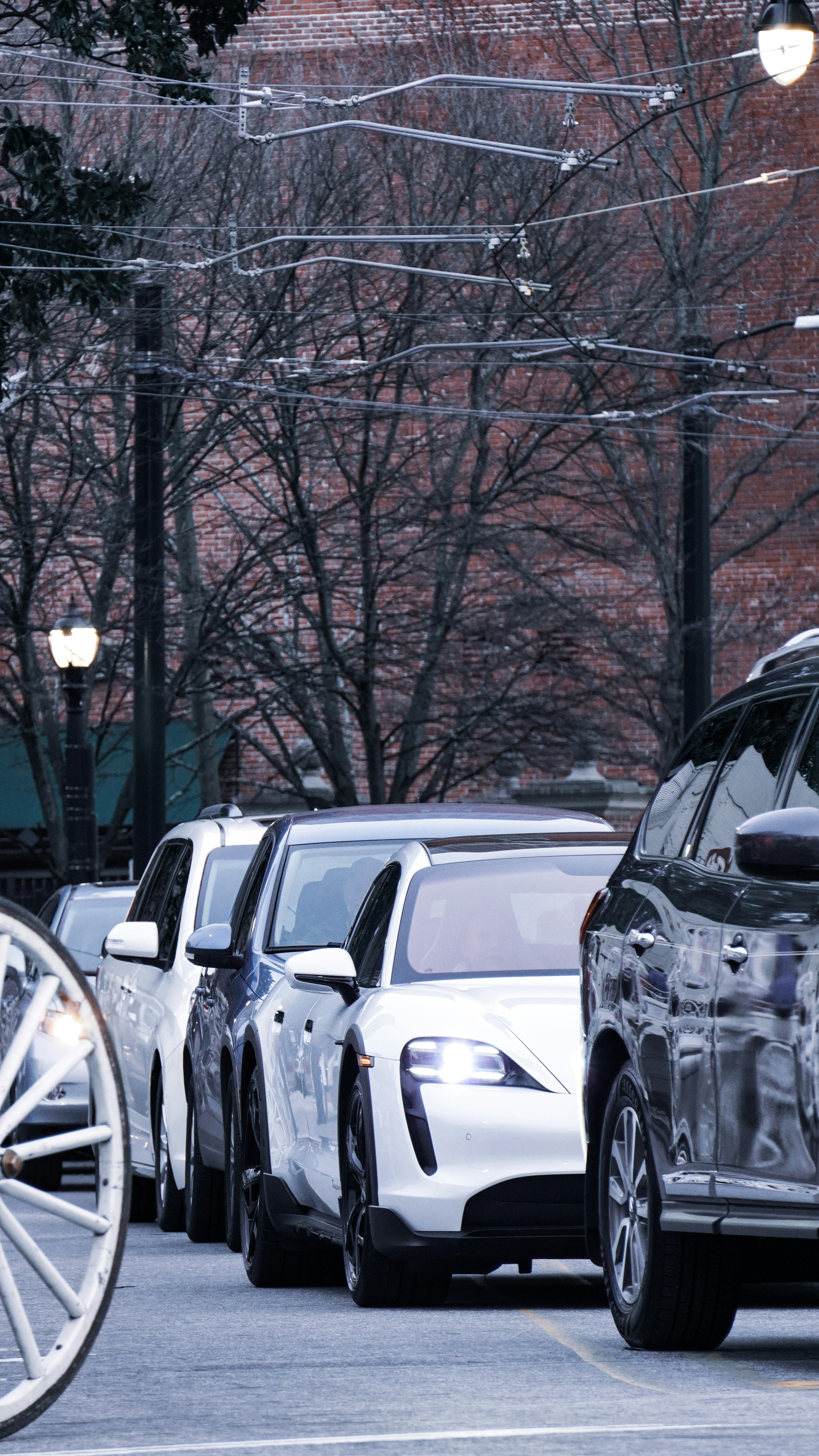 A line of cars parked on the side of a road photo – Free Car Image on ...