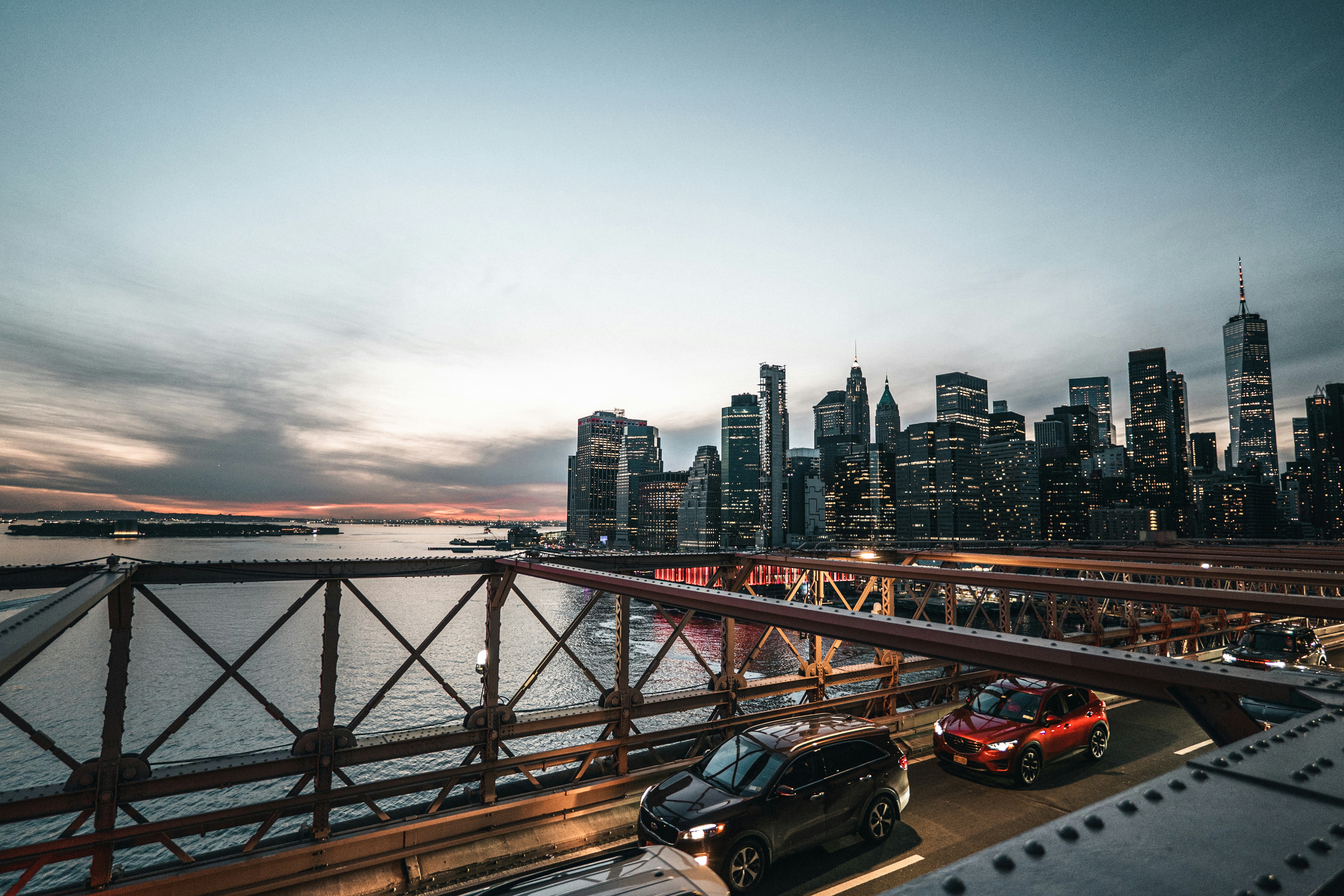 City Bridge Over Water: Evening Drive Beneath the Skyline