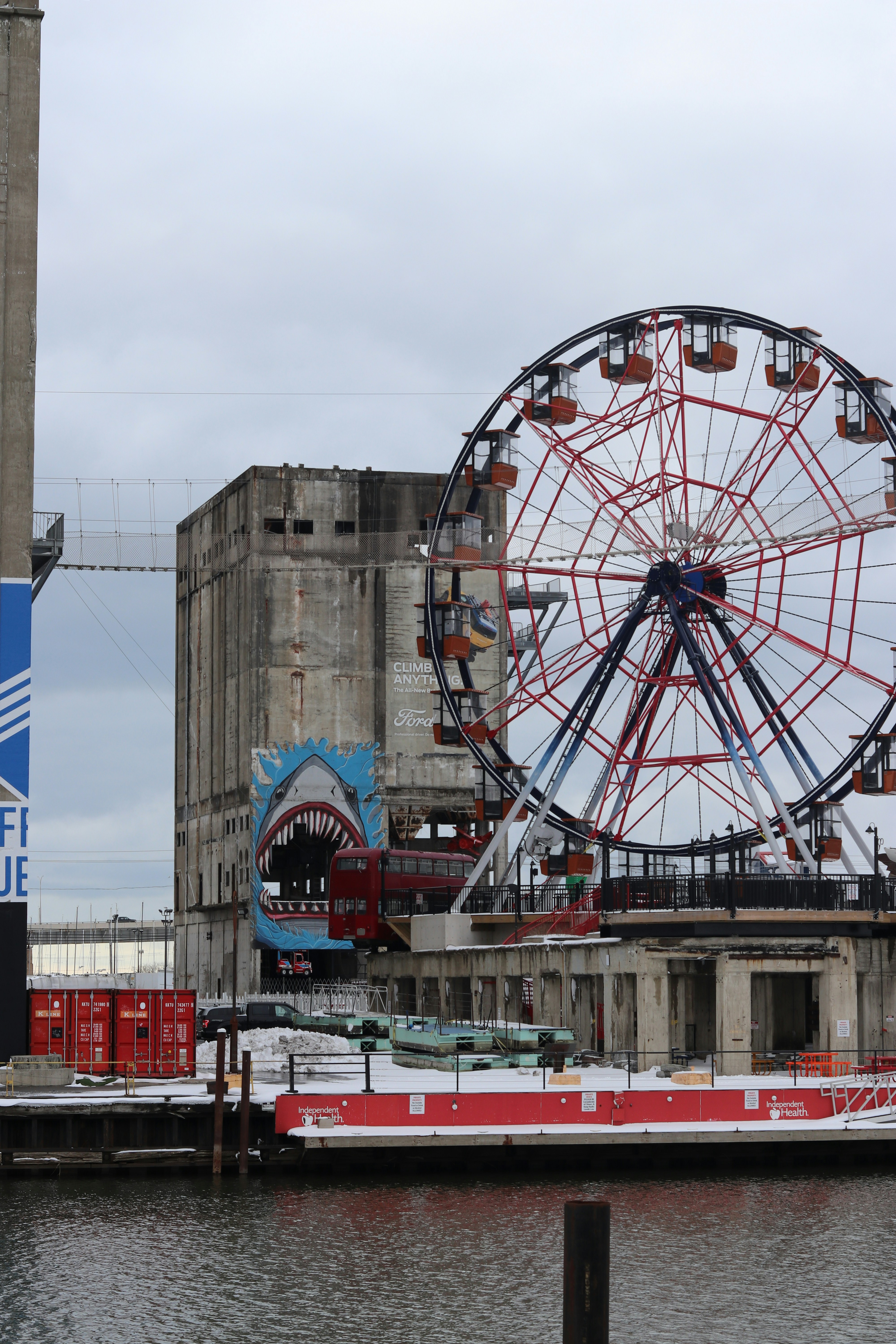 a large ferris wheel sitting next to a large building