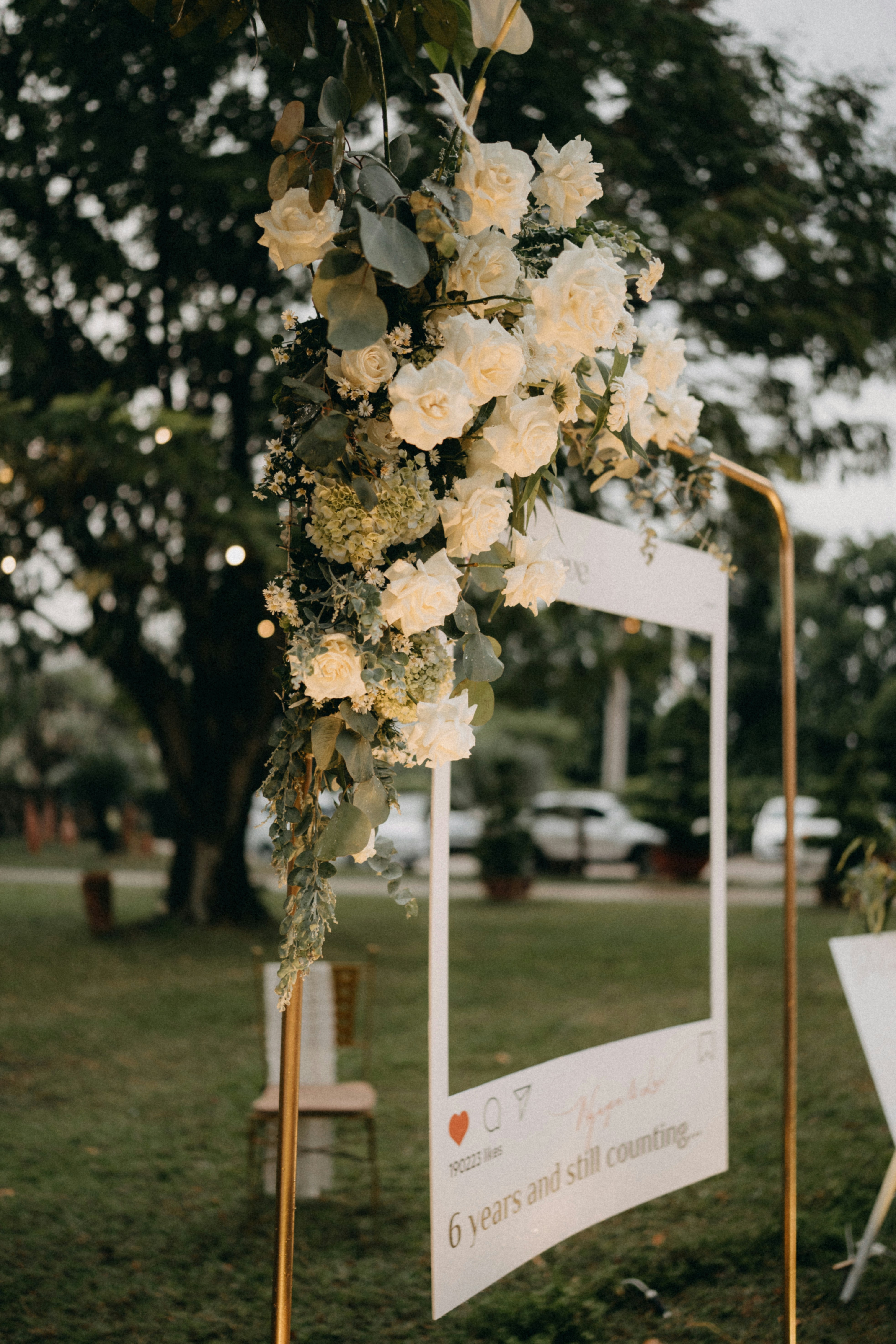 Floral Frame: Cream Roses Draping a Keepsake Sign