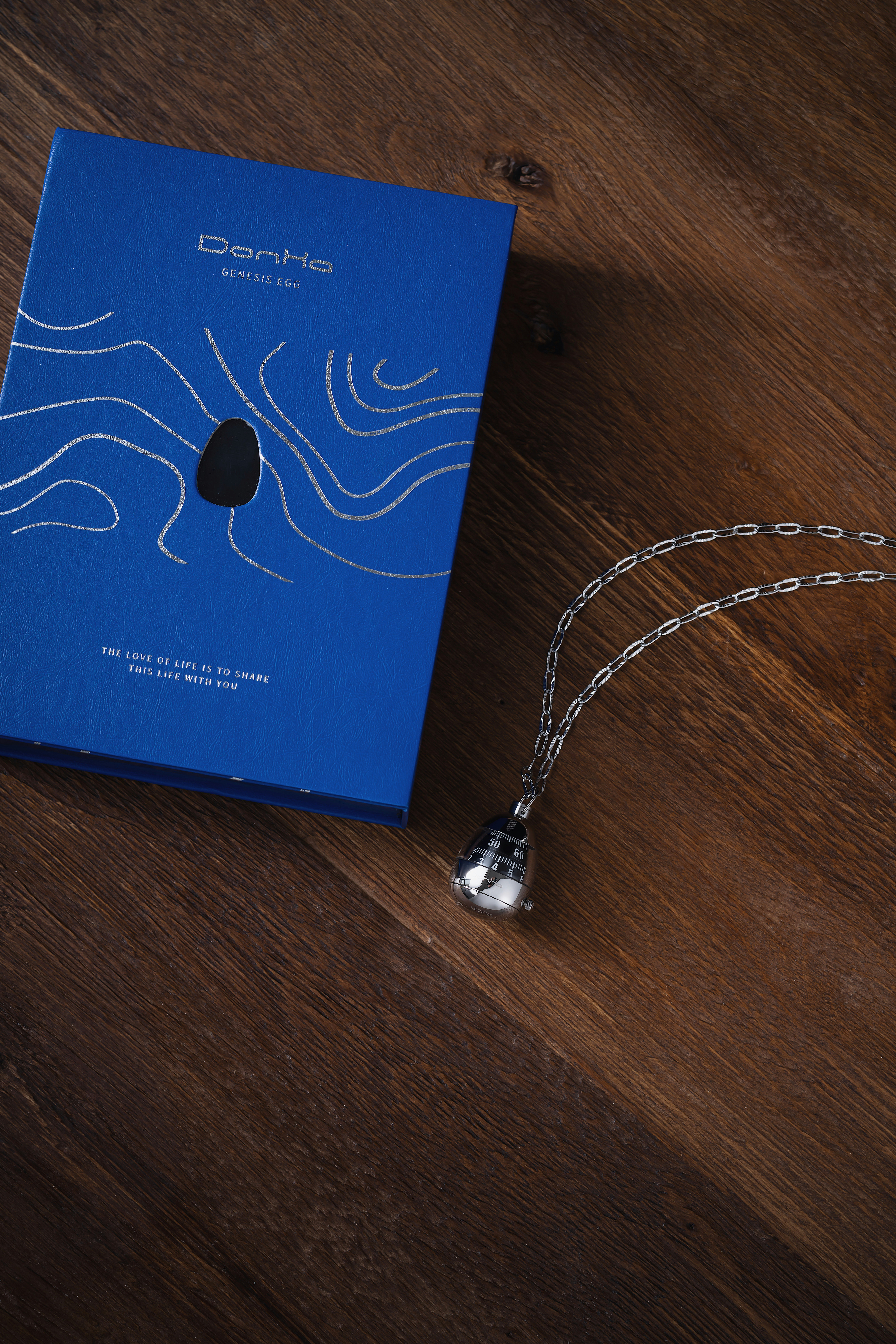 Blue Box and Necklace on a Warm Wooden Canvas