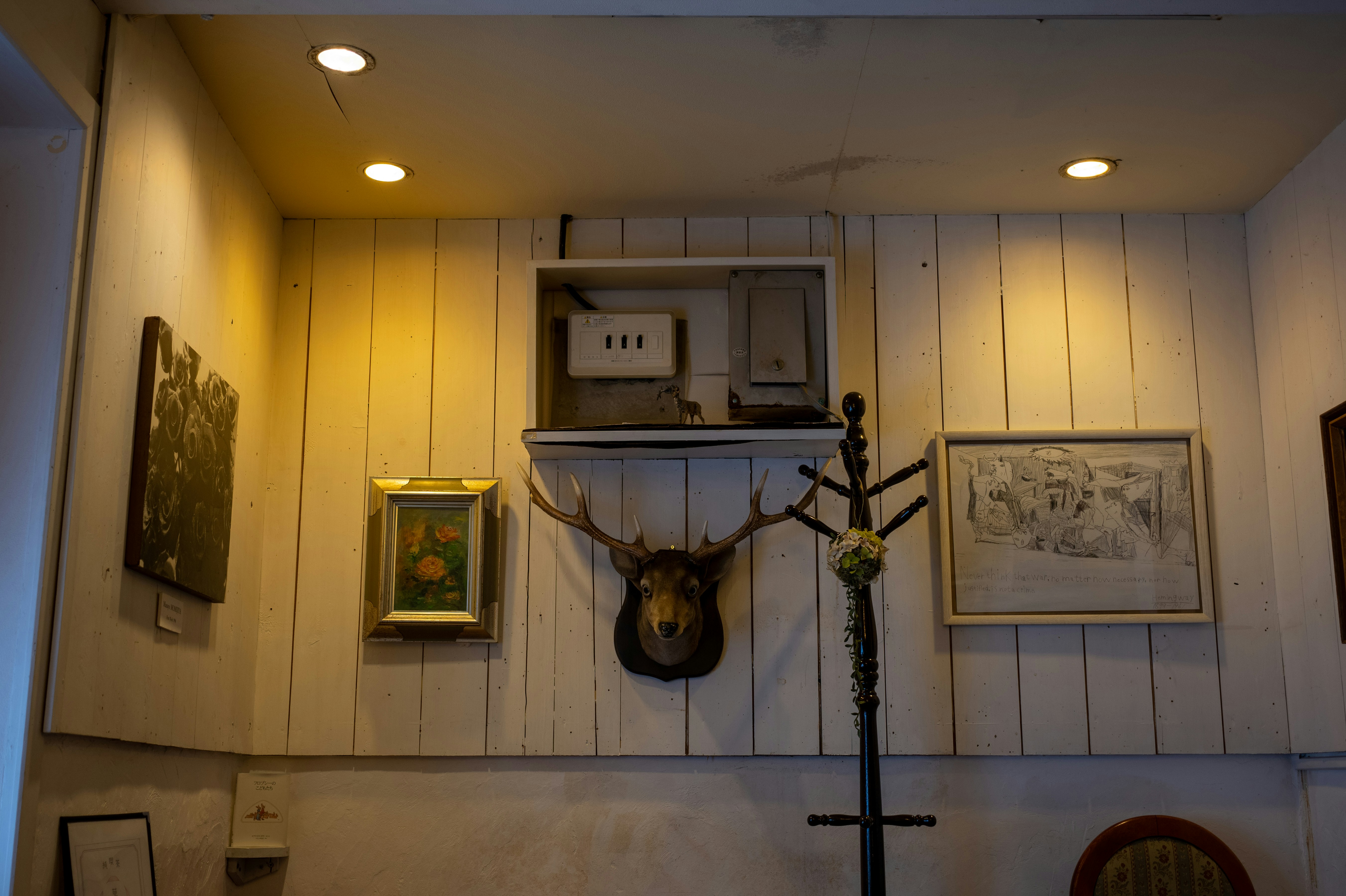 Mounted Deer Head and Vintage Wall Decor in Warm Gallery Lighting