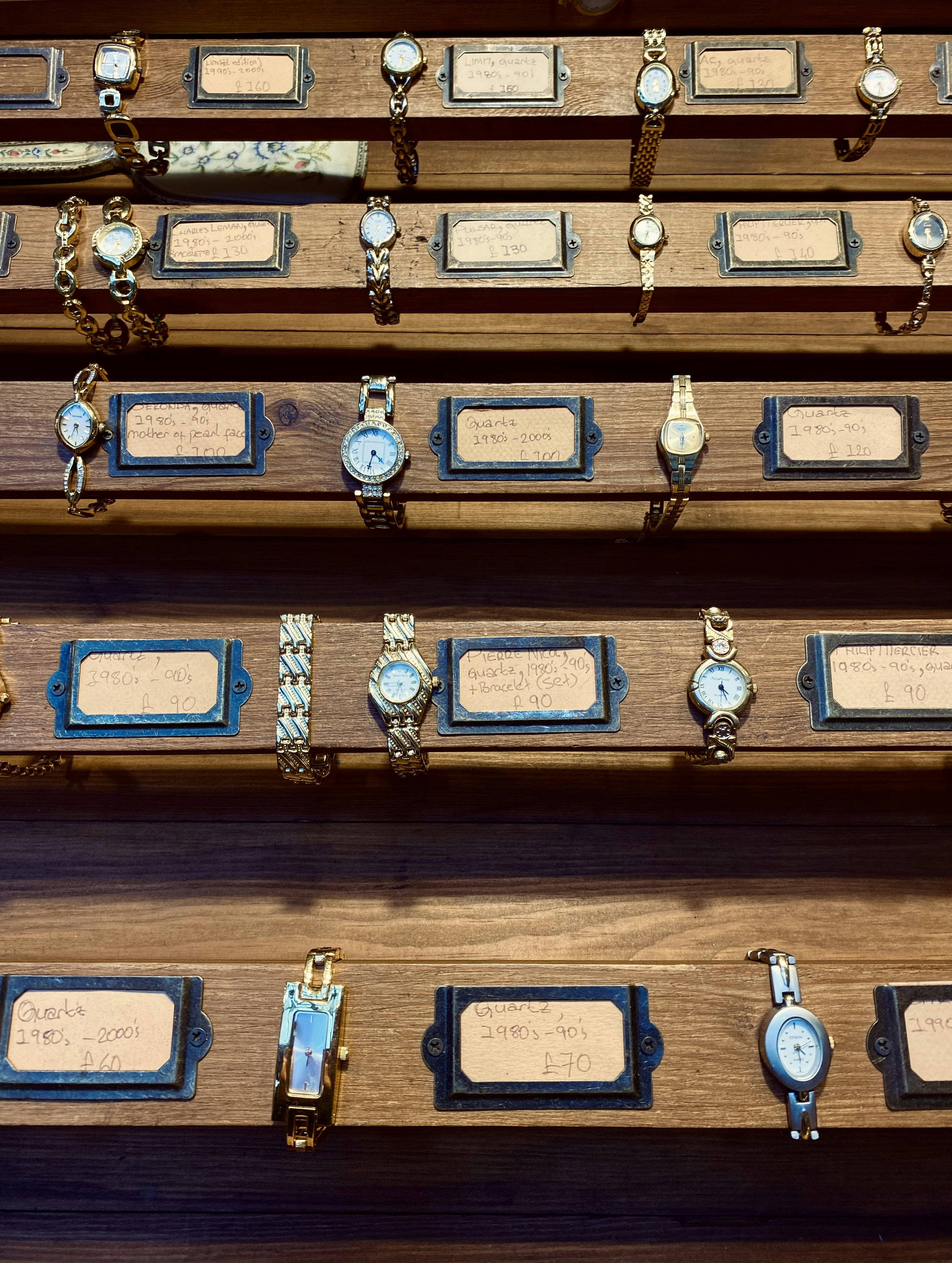 A collection of watches on display in a wooden case photo – Free Time ...