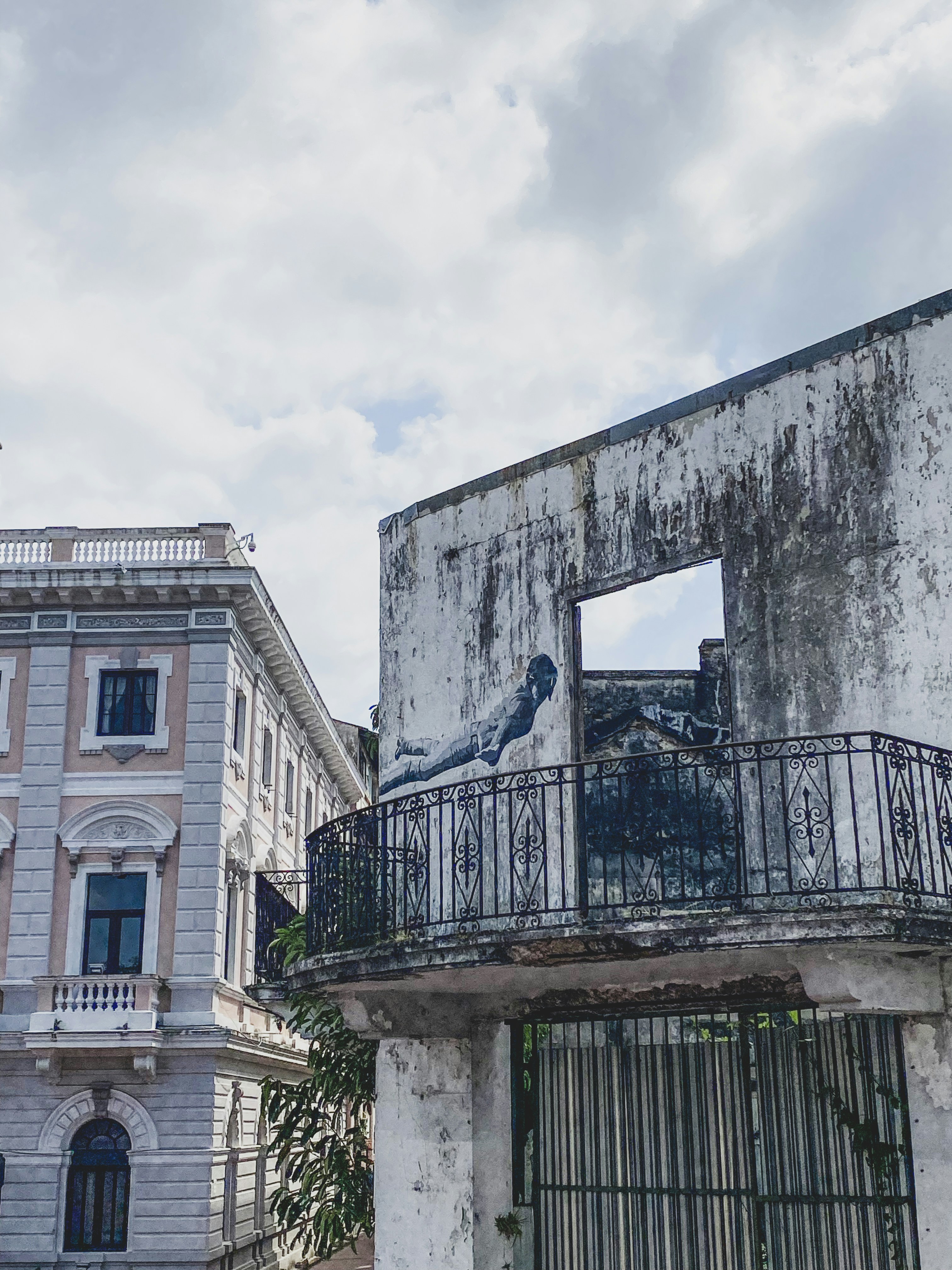 Weathered Balcony, Silent Facade: A City in Quiet Decay