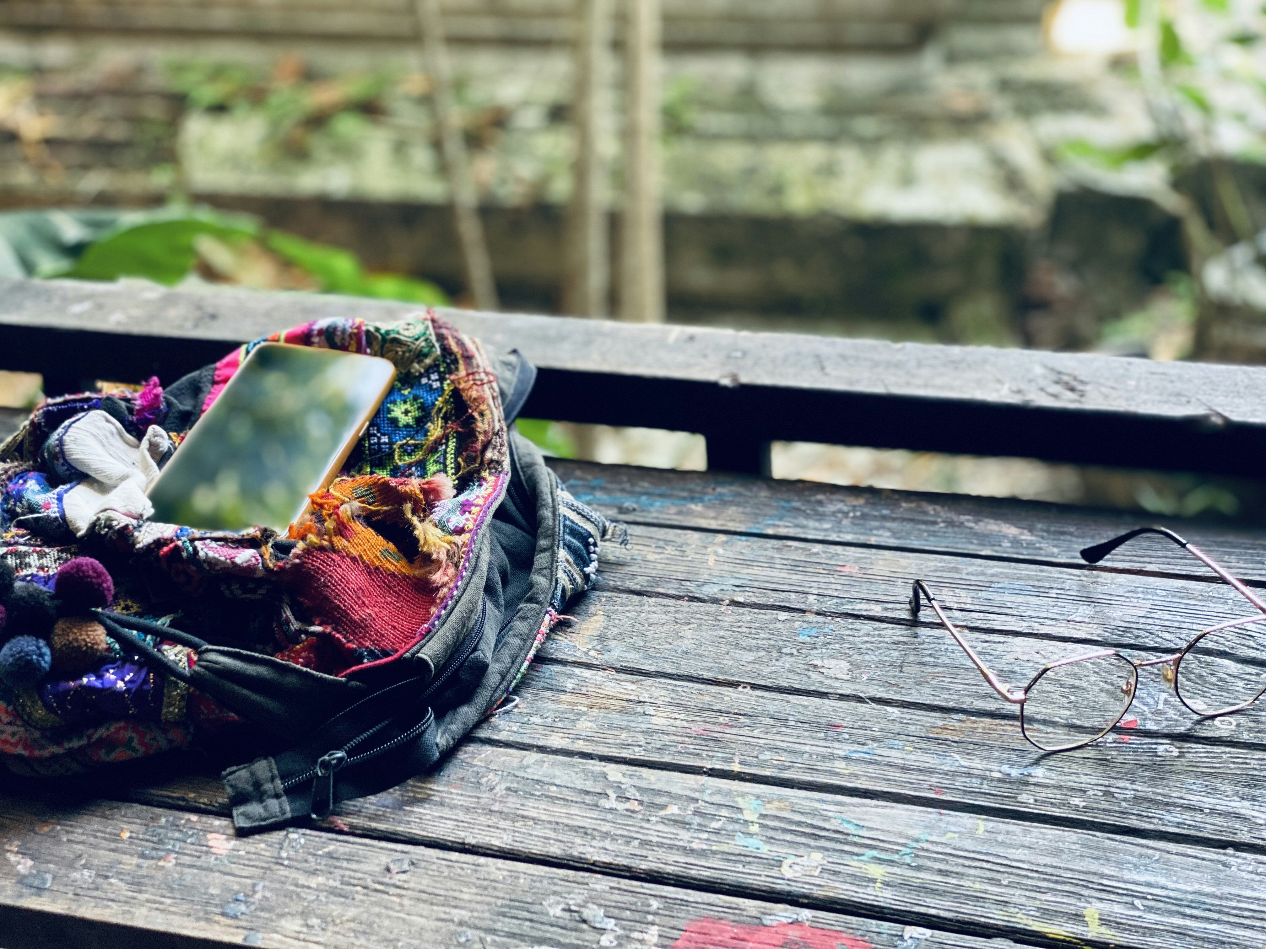 Colorful backpack spill reveals a tablet and tangled supplies