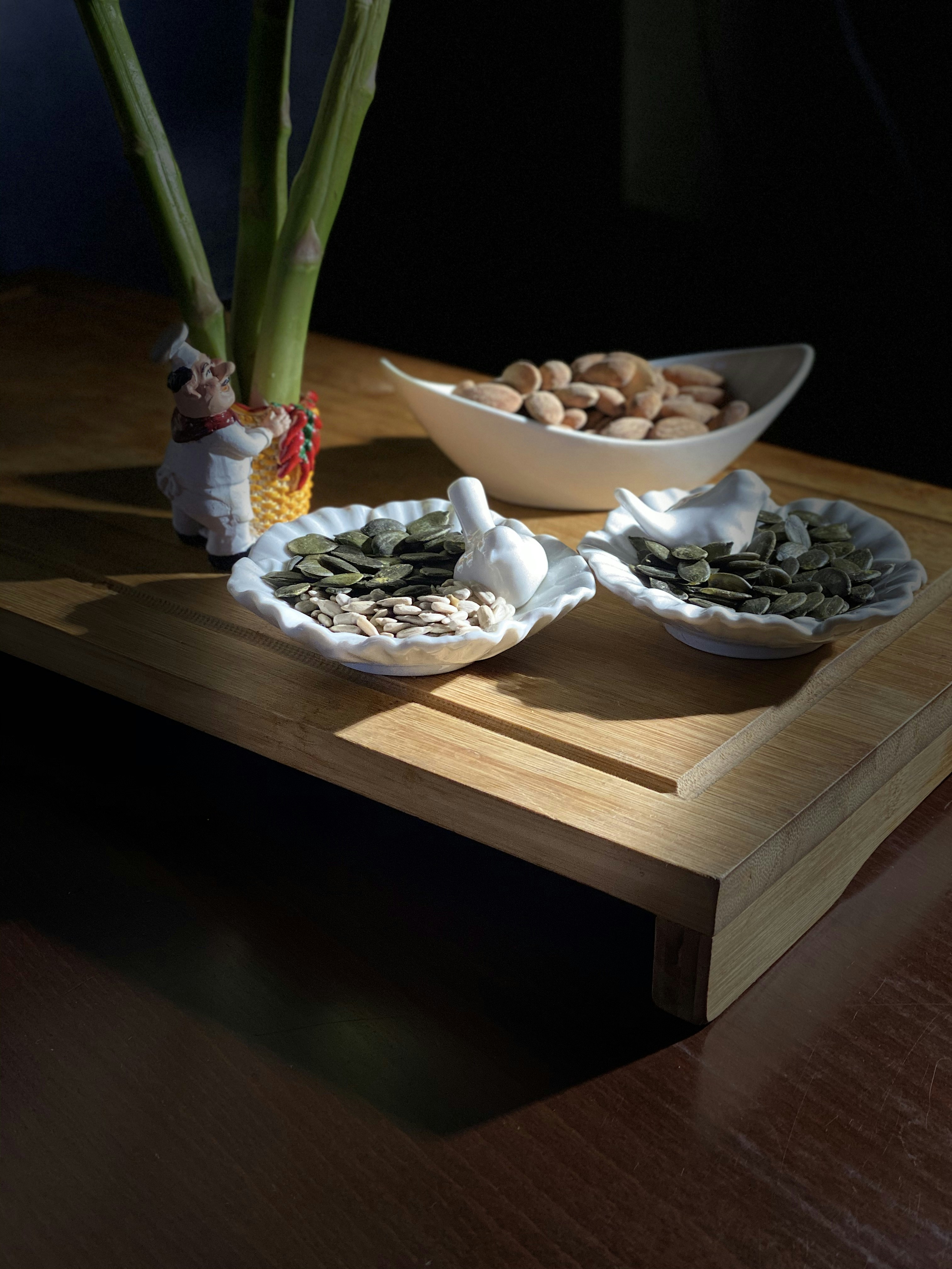 Still Life on a Wooden Tray: Seeds, Nuts, and a Tiny Ceramic Scoop