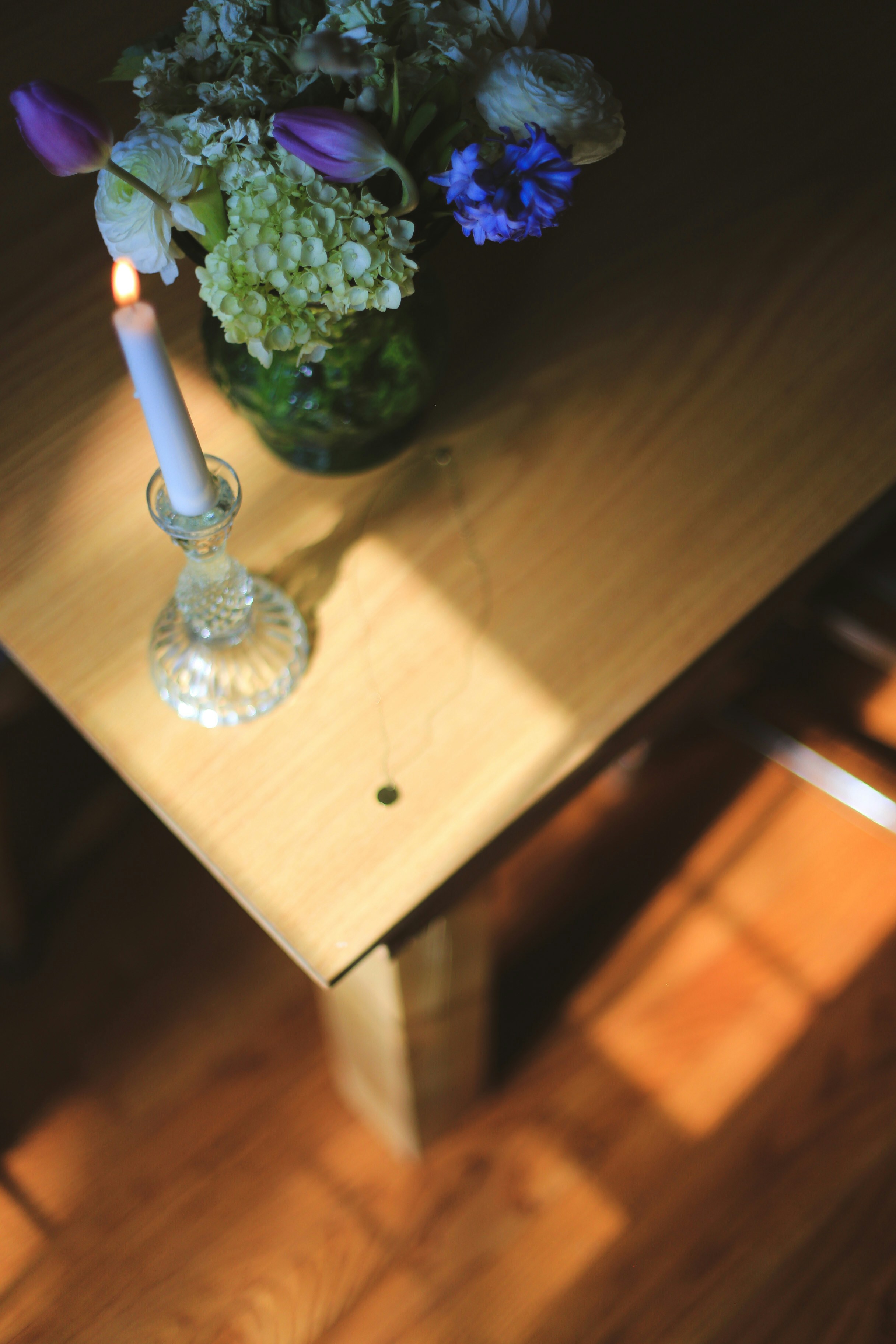 Flame, Glass, and Petals: A Quiet Tabletop Moment