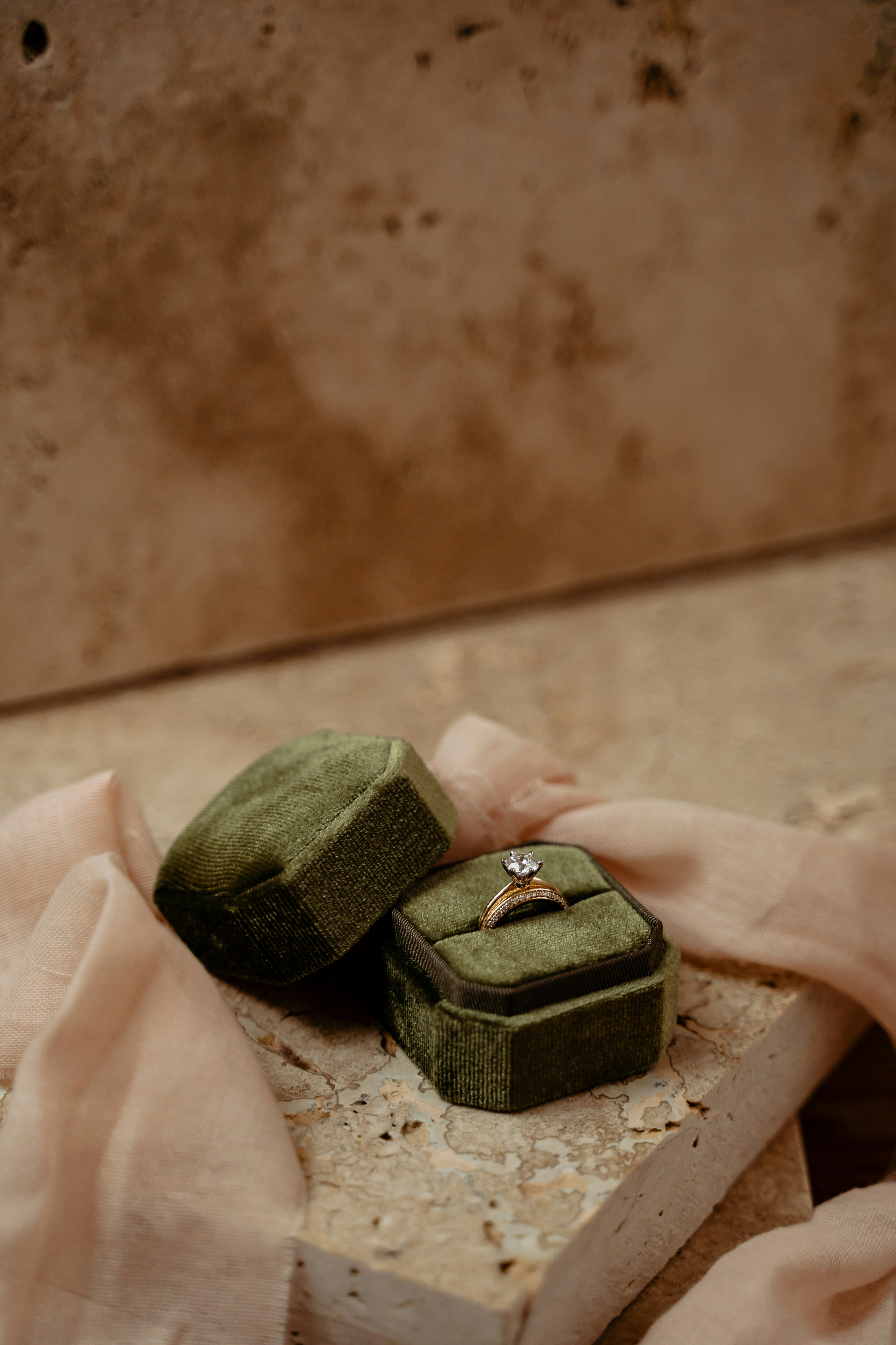 Diamond on Velvet: A Quiet Promise Resting on Weathered Stone