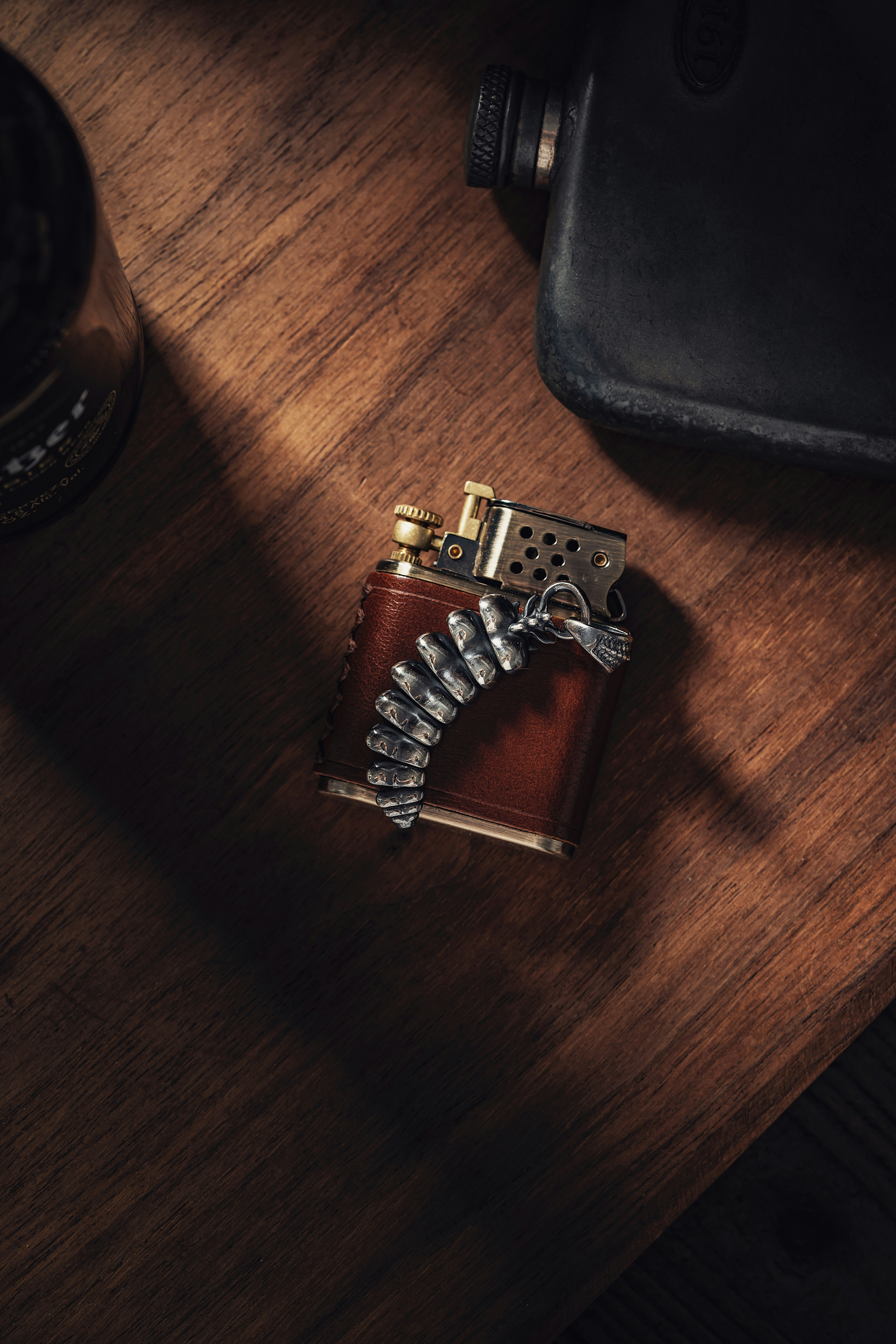 A small lighter sitting on top of a wooden table photo – Free Lighter ...