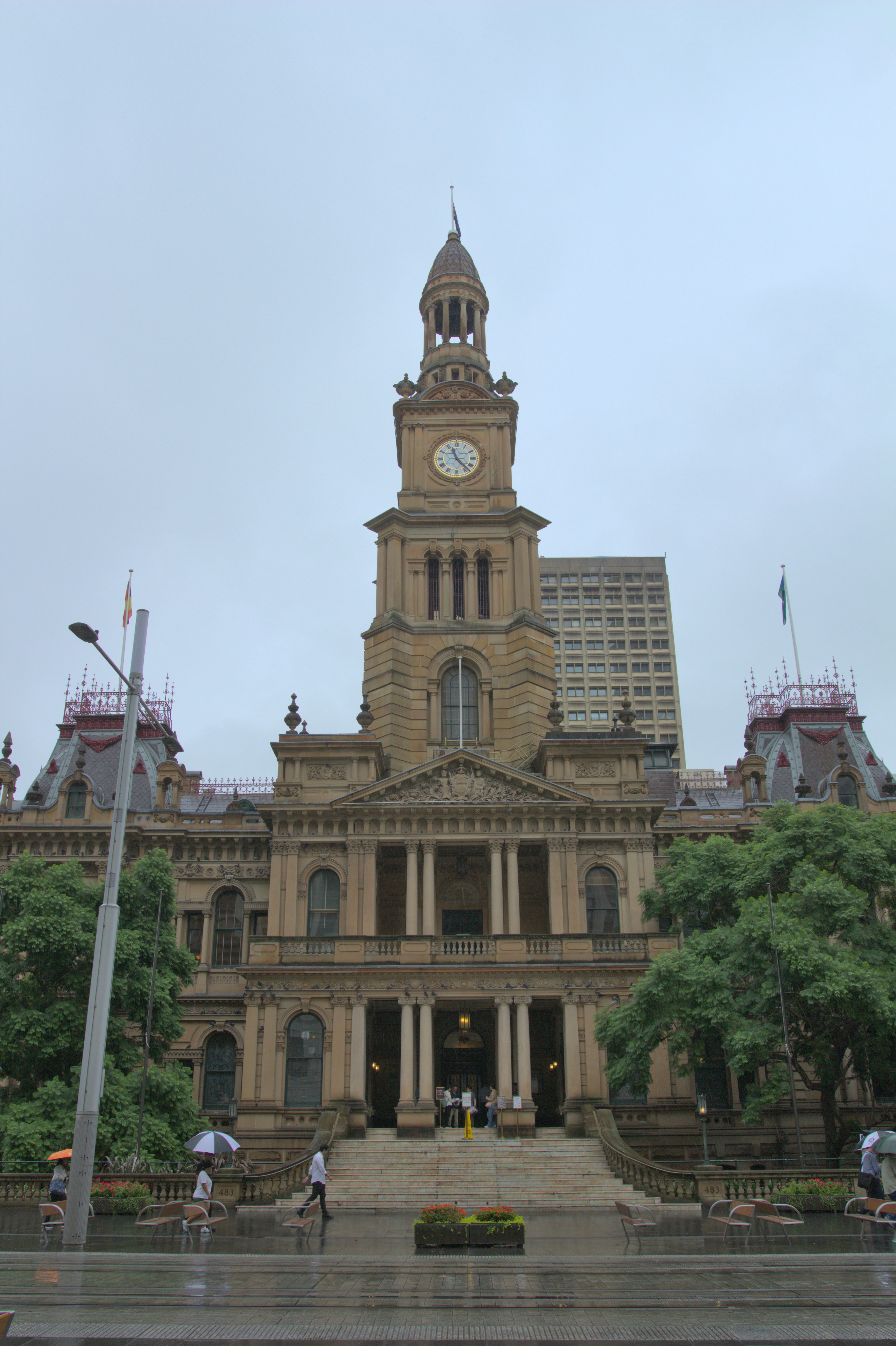 Clock Tower Rising Over a Rain-Washed City Hall