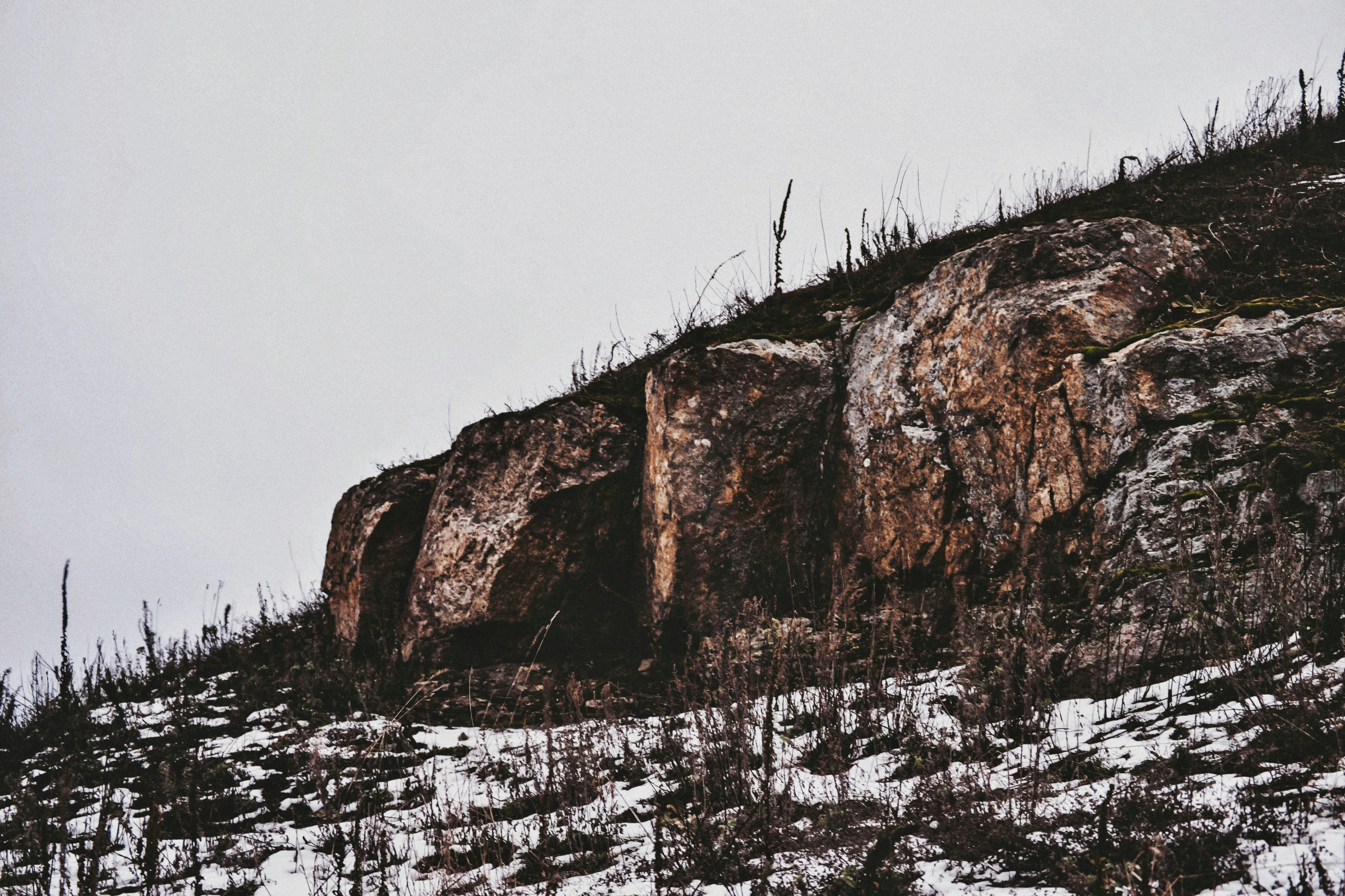 Granite Colossus on a Snow-Dusted Slope