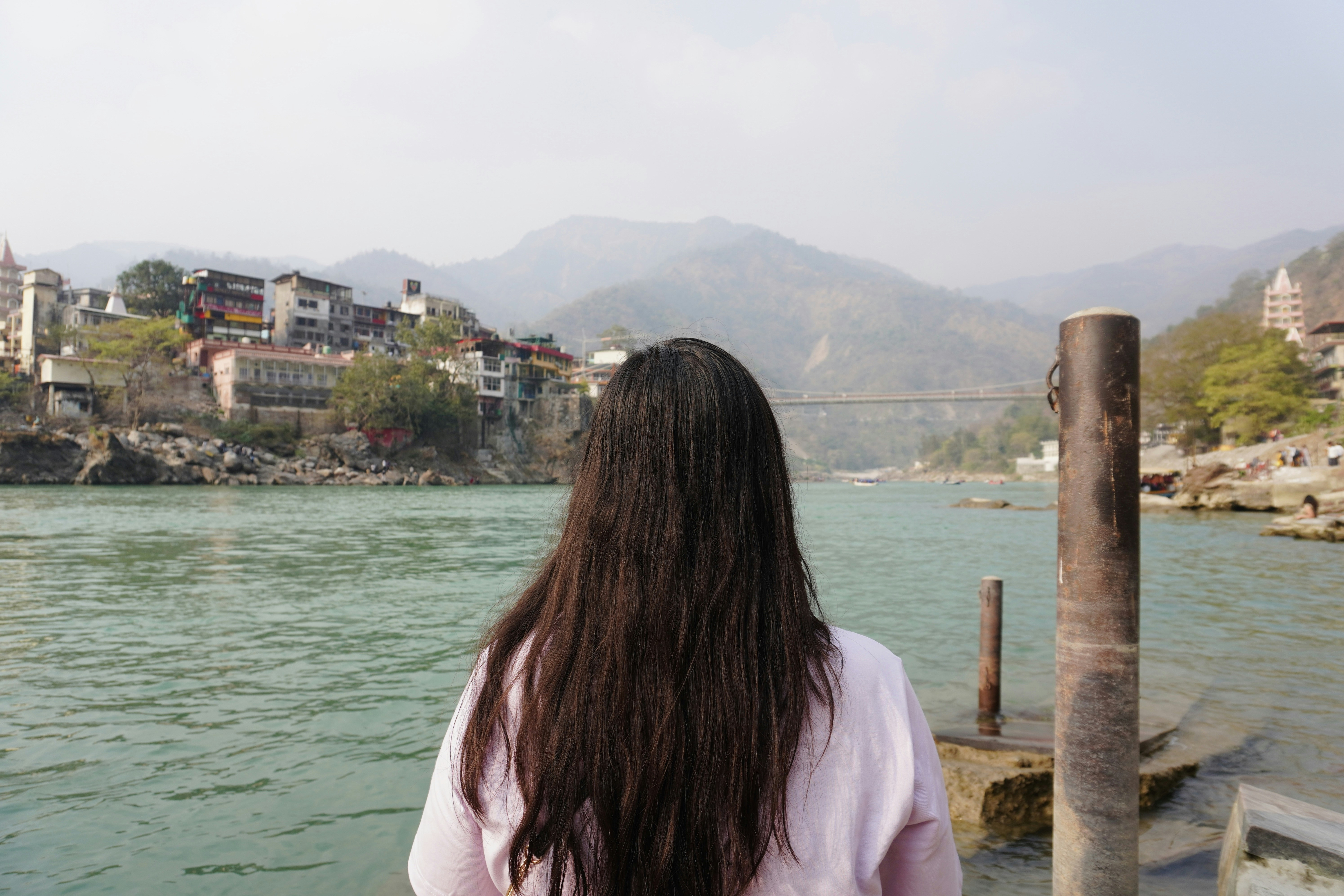 a woman looking out over a body of water
