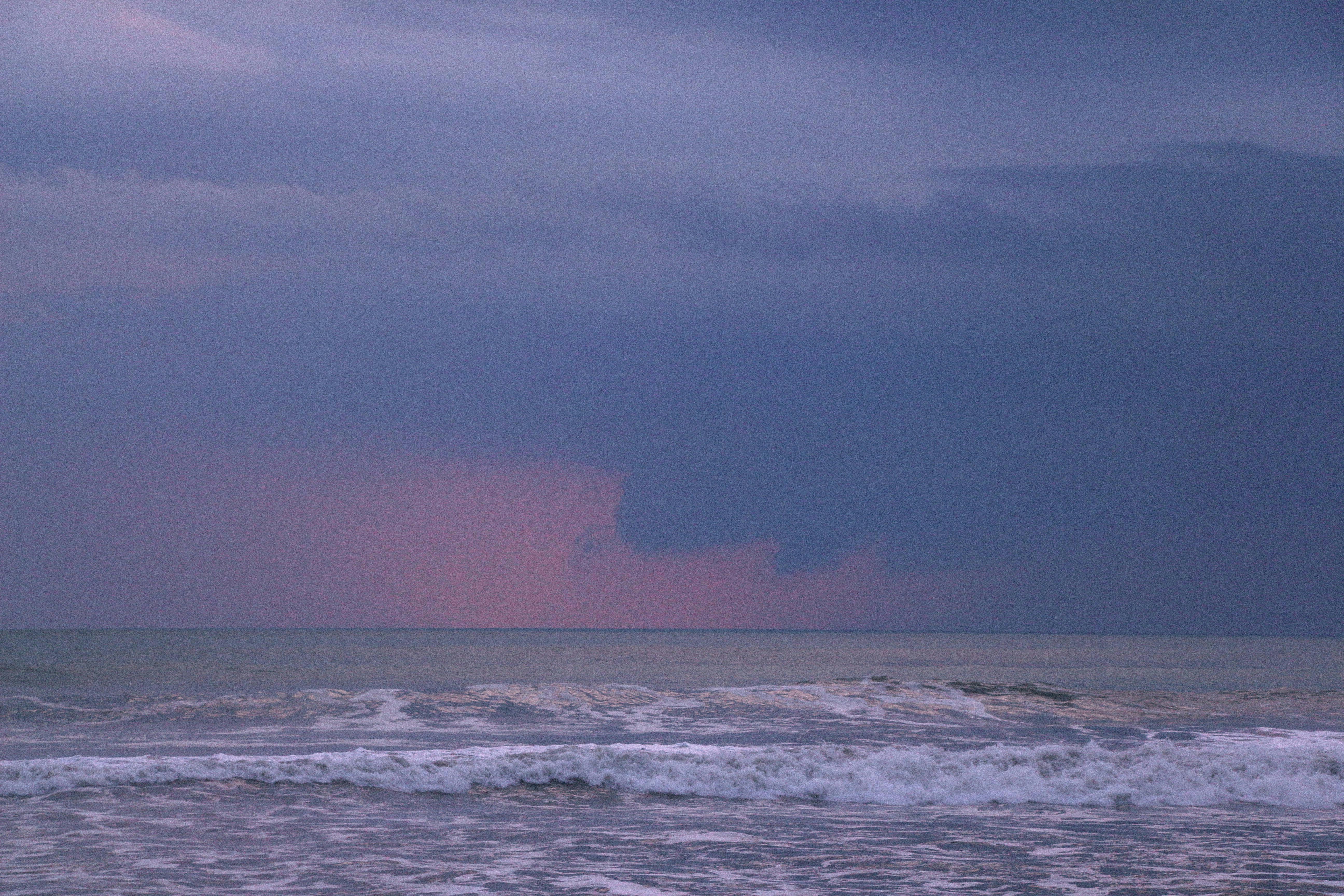 a person riding a surfboard on a wave in the ocean