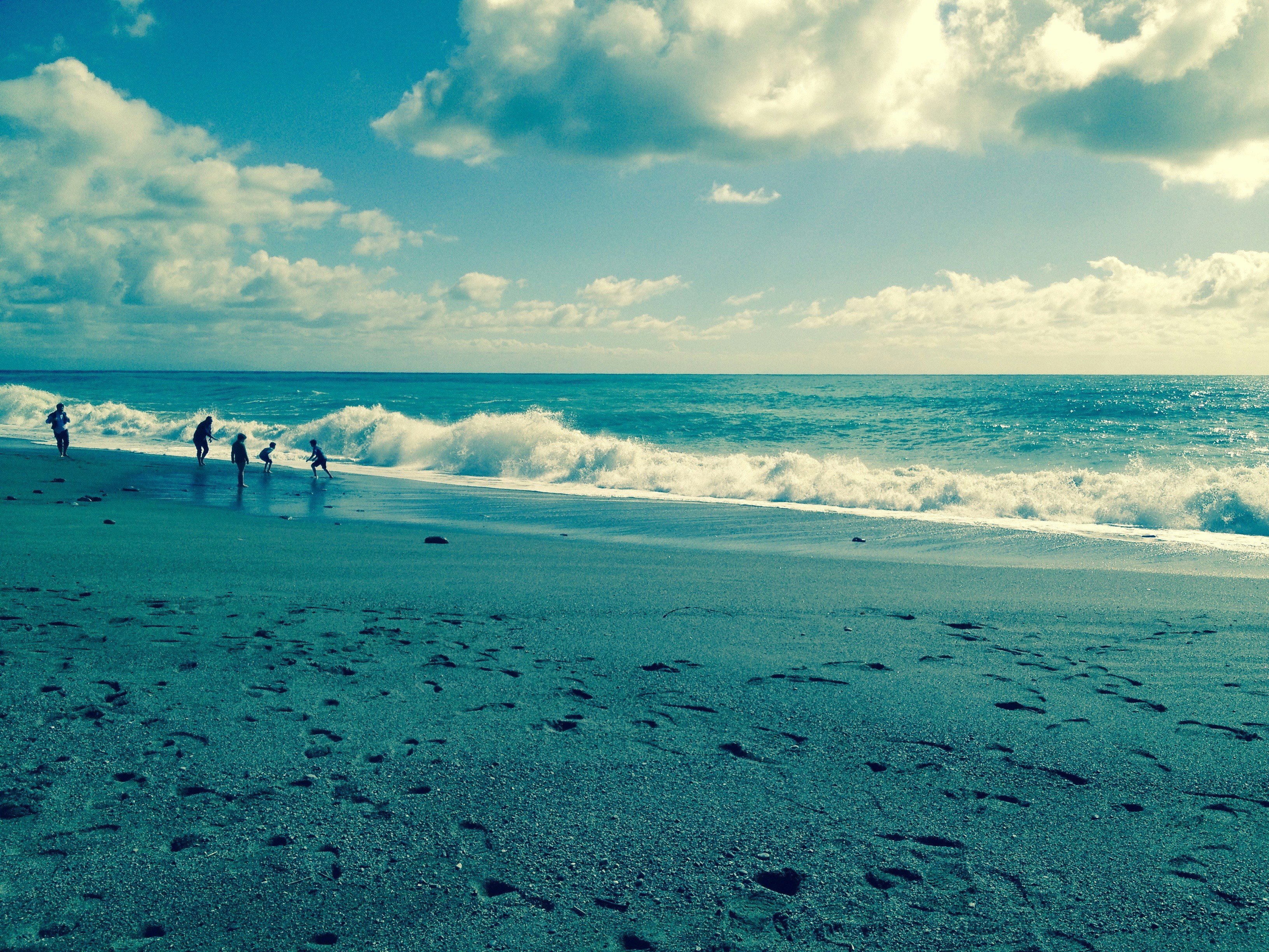 Vibrant Seaside Gathering Under Expansive Skies
